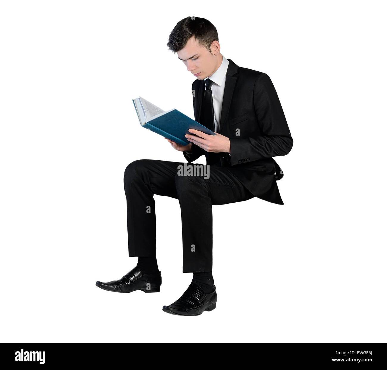 Confident student reading book Cut Out Stock Images & Pictures - Alamy