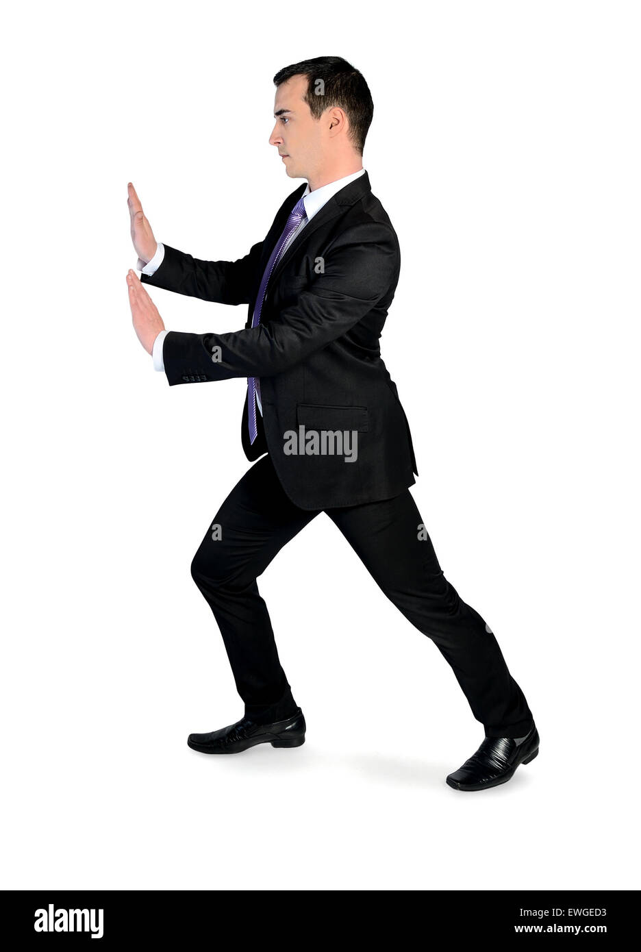 Isolated business man push something Stock Photo - Alamy