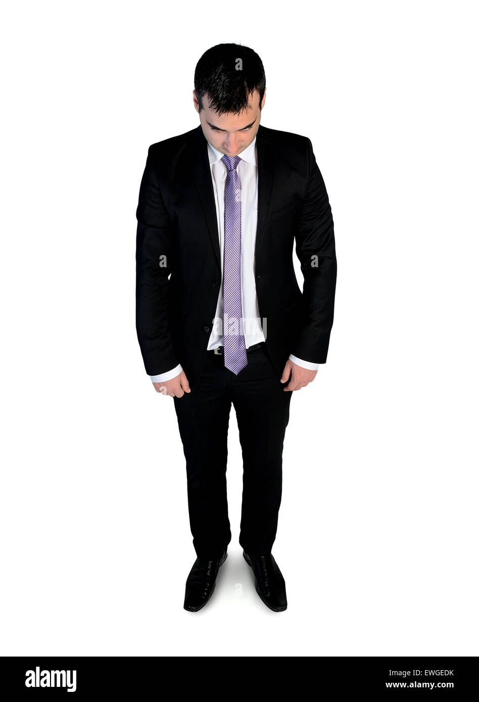 Isolated business man guilty looking down Stock Photo - Alamy