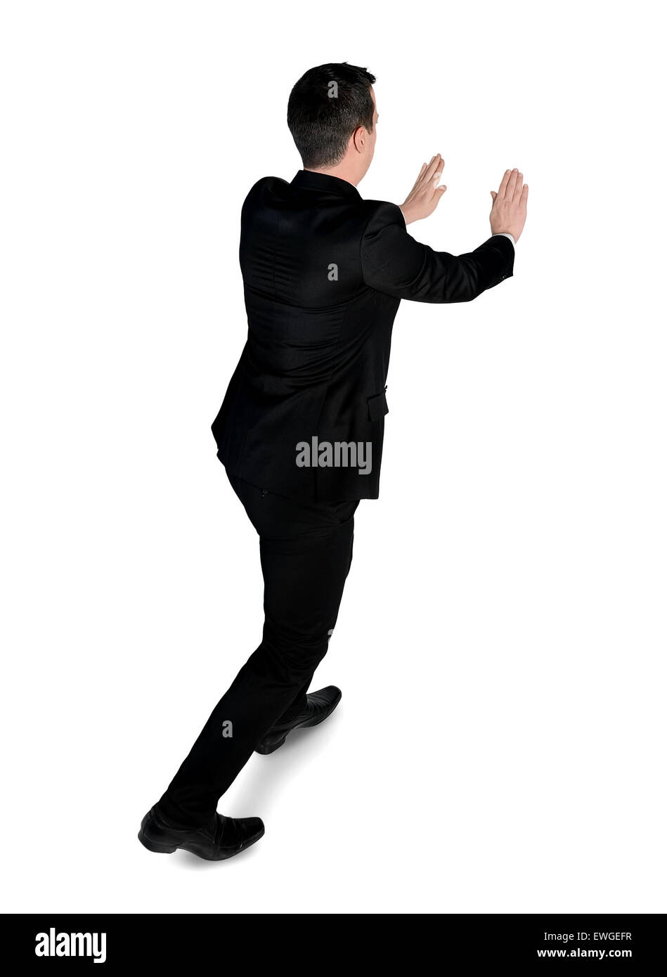 Isolated business man push something Stock Photo - Alamy