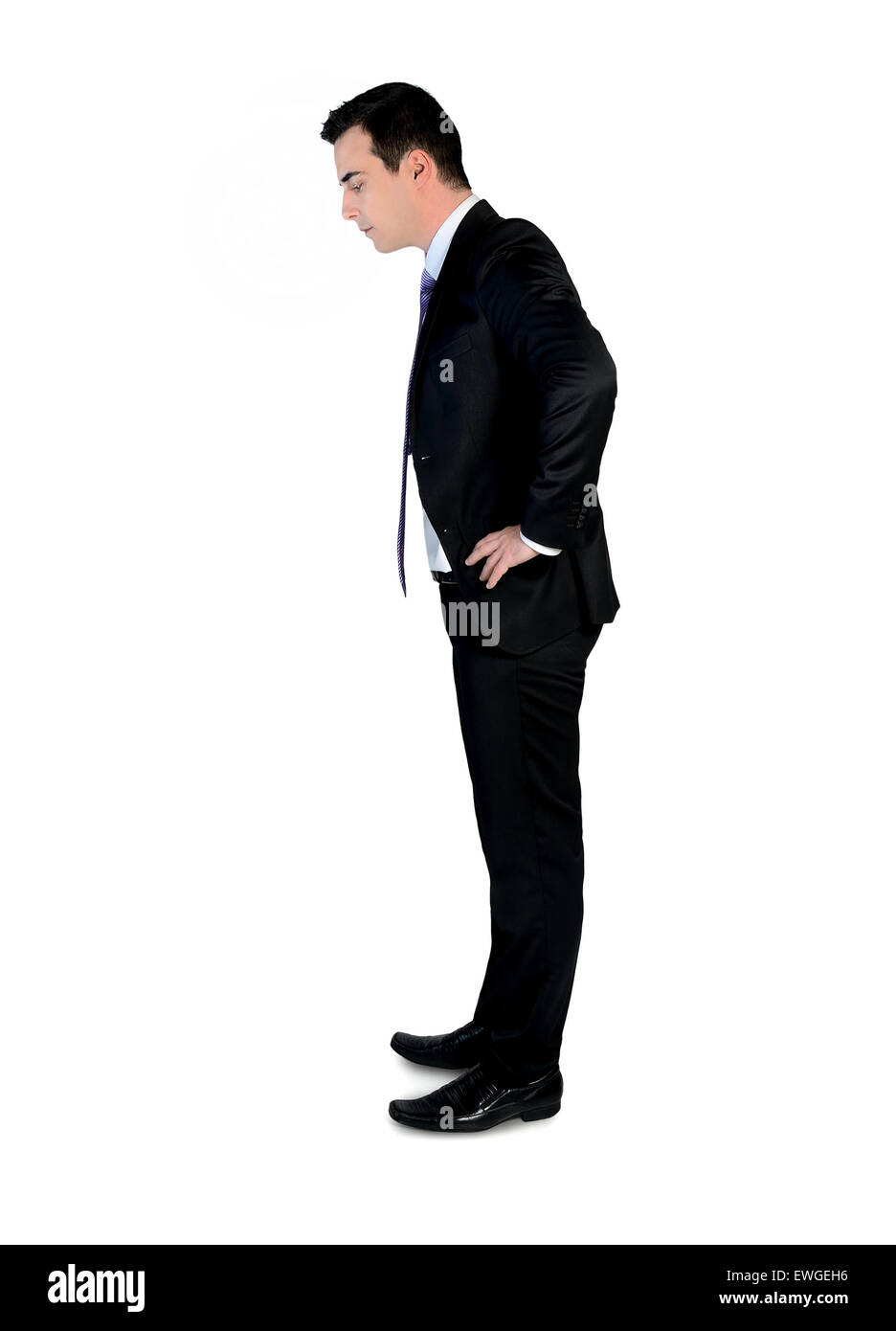 Isolated business man looking down Stock Photo - Alamy