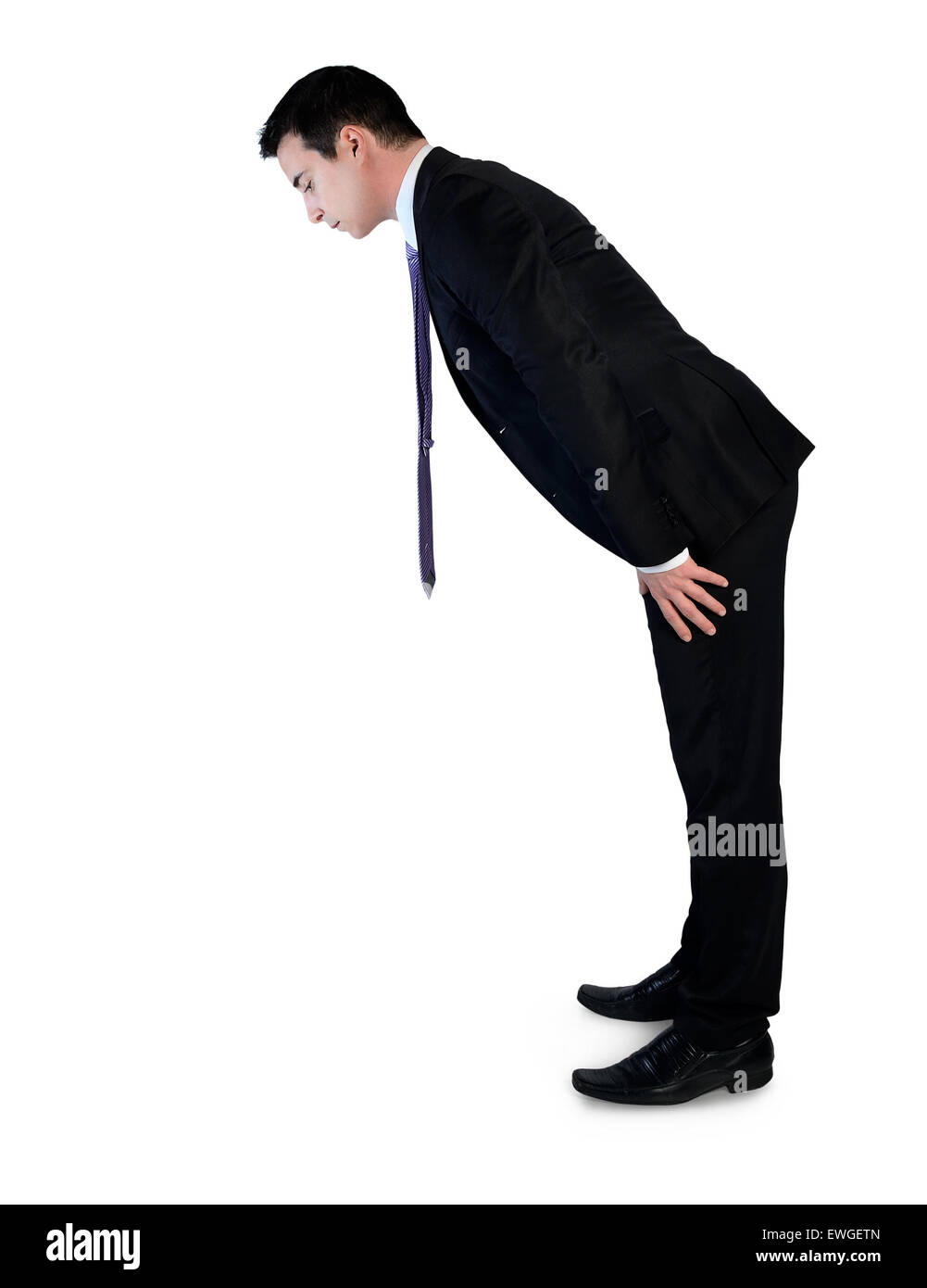 Isolated business man looking down Stock Photo - Alamy