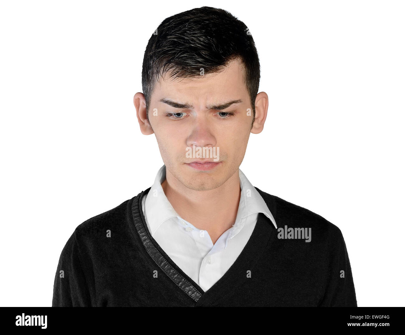 Isolated young man sad looking down Stock Photo - Alamy
