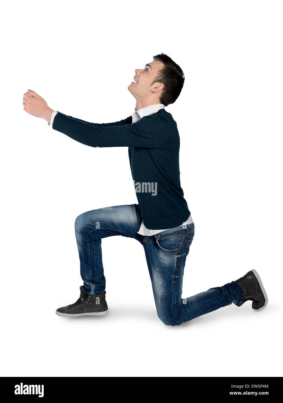 Isolated young man giving something Stock Photo - Alamy