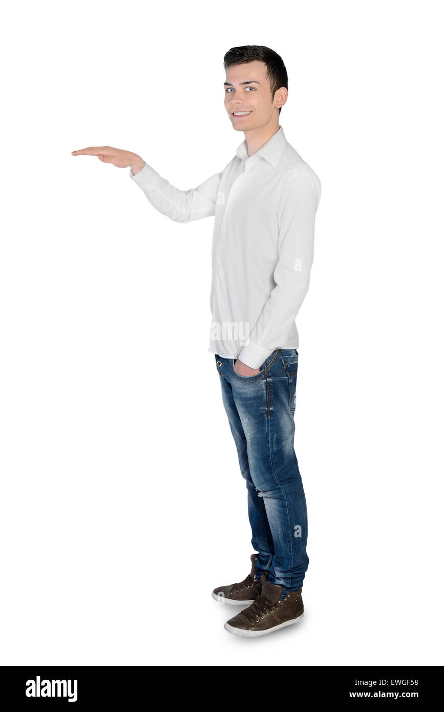 Isolated young man presenting something Stock Photo - Alamy