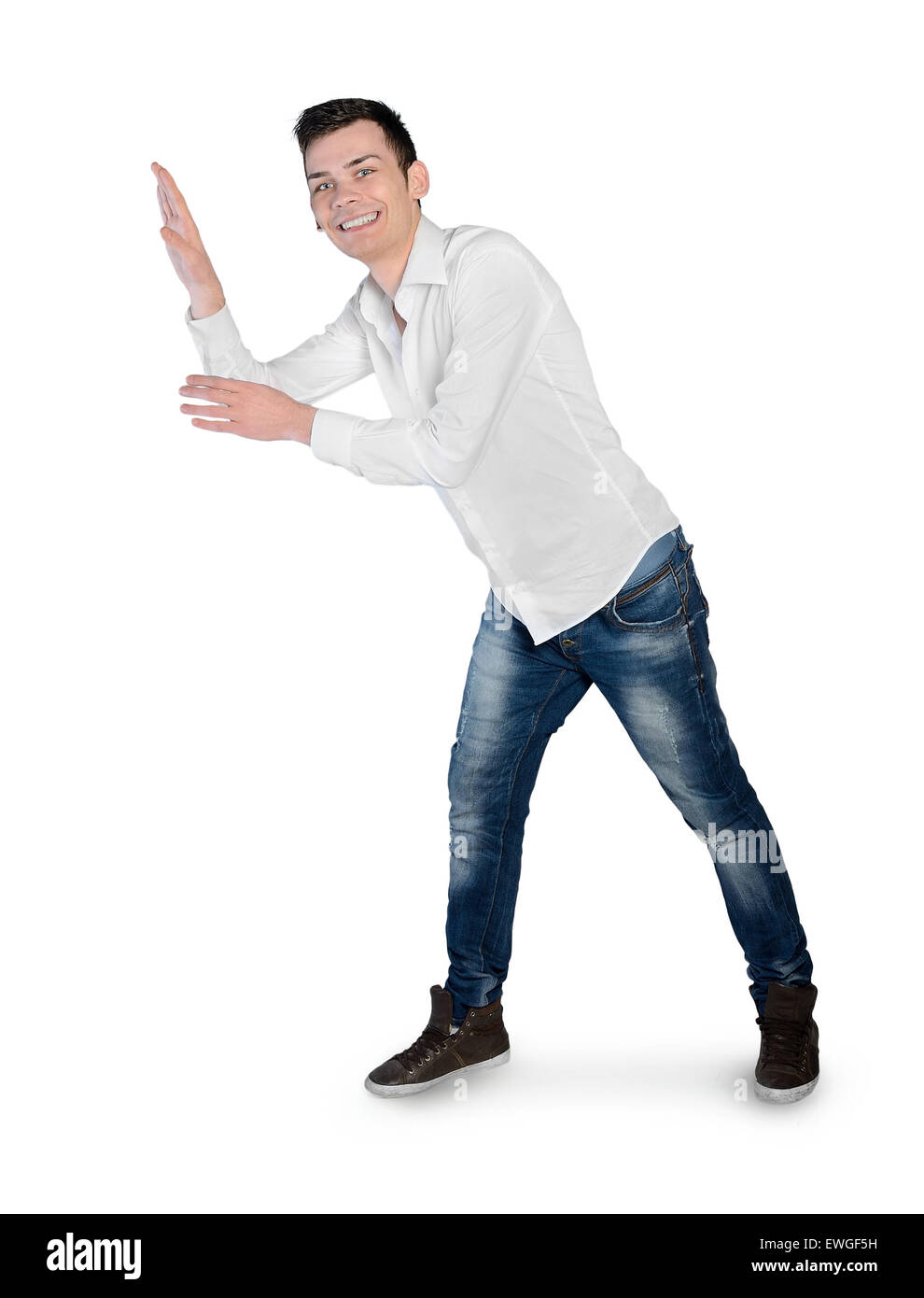 Isolated young man presenting something Stock Photo - Alamy