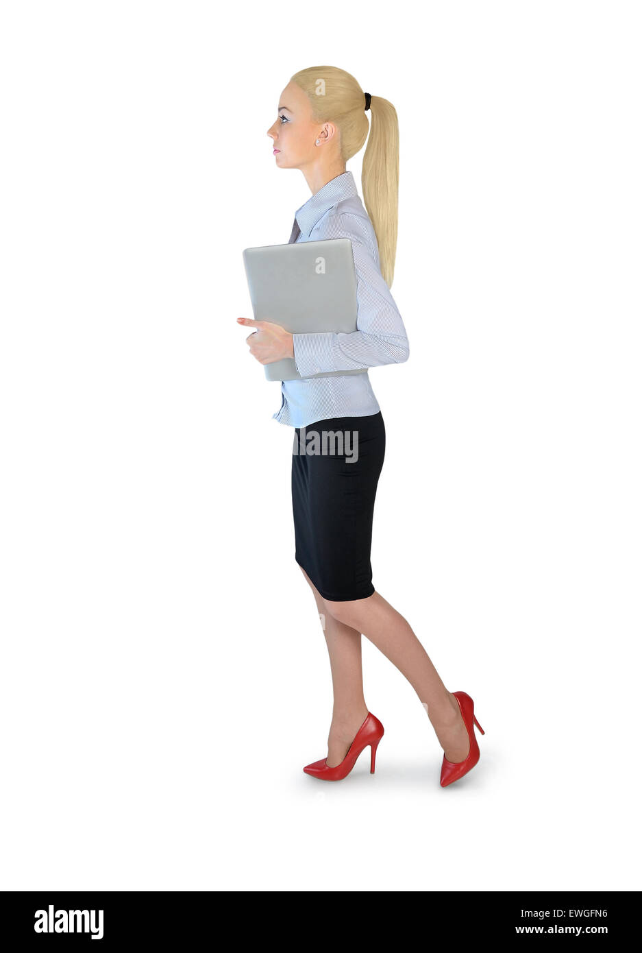 Isolated business woman walking with laptop Stock Photo - Alamy