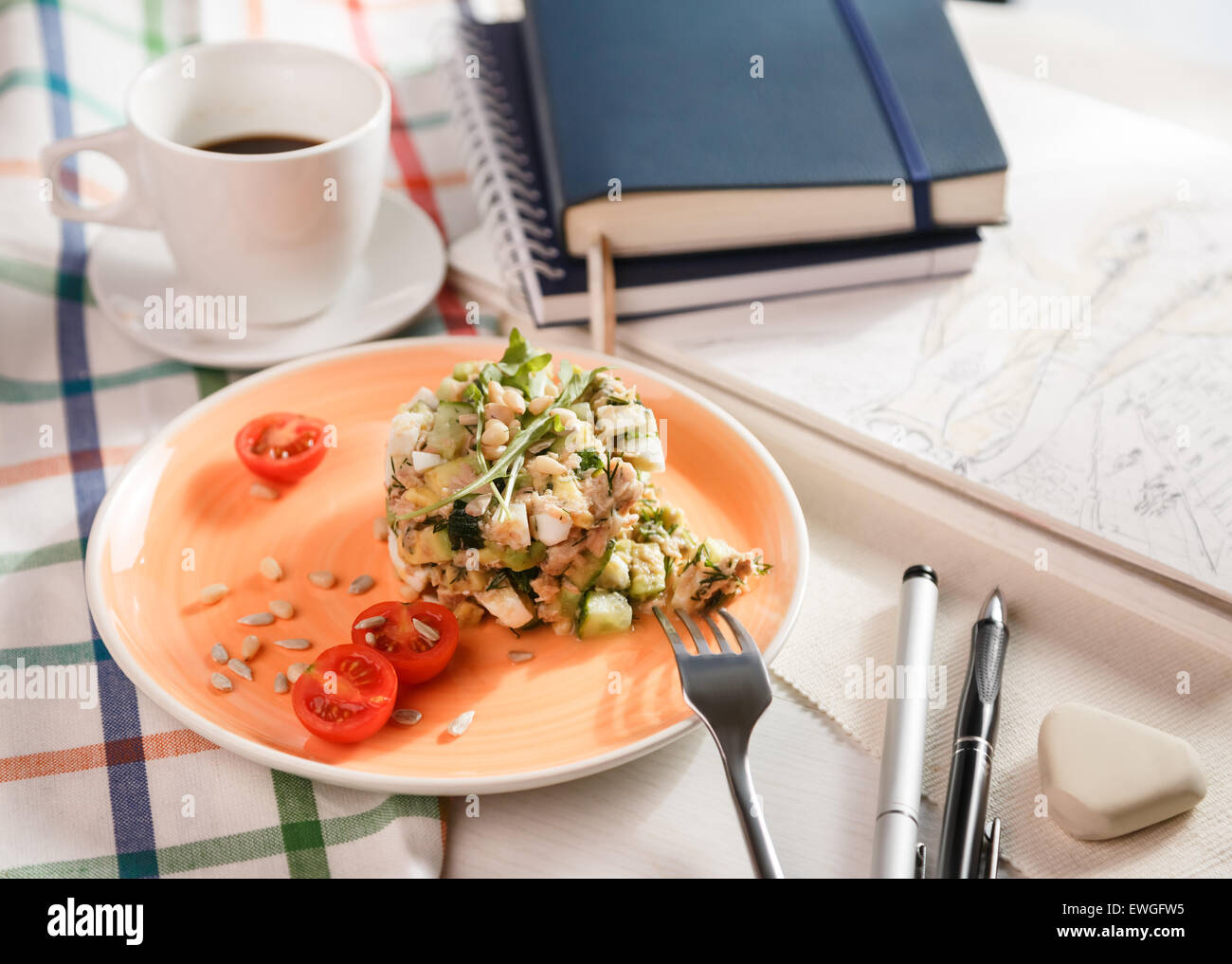Russian salad for breakfast on a checkered cloth and notepads Stock Photo - Alamy