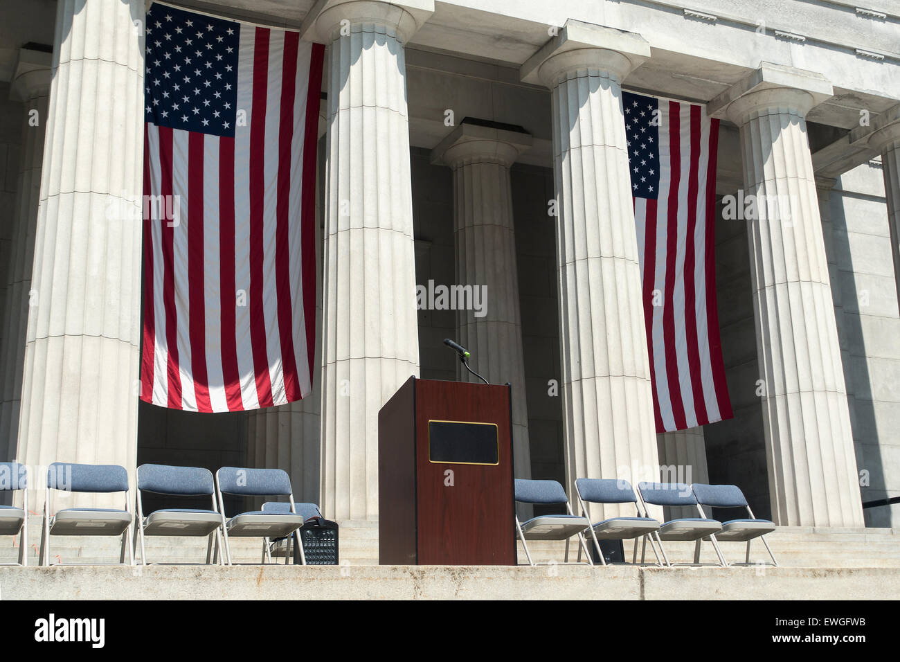 American flags behind podium on stage outdoors Stock Photo - Alamy
