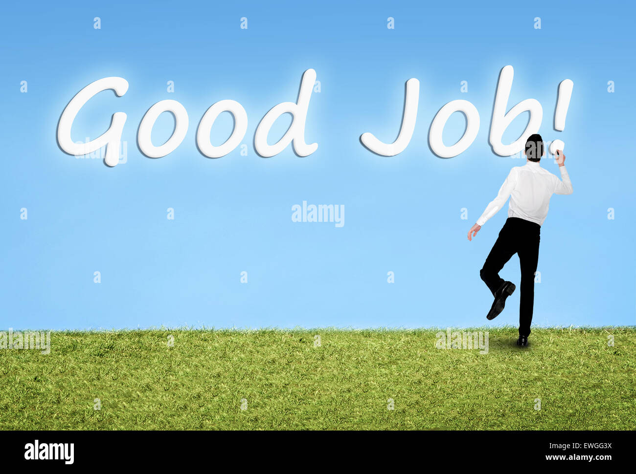 Business man writing on sky Good job word Stock Photo - Alamy