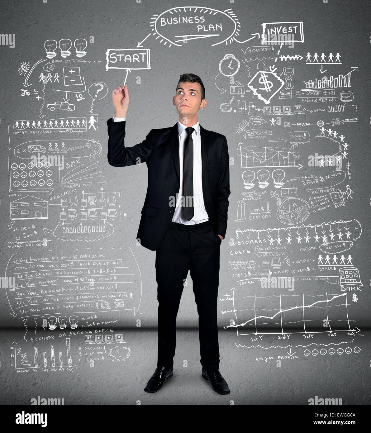 Business man writing business plan Stock Photo - Alamy