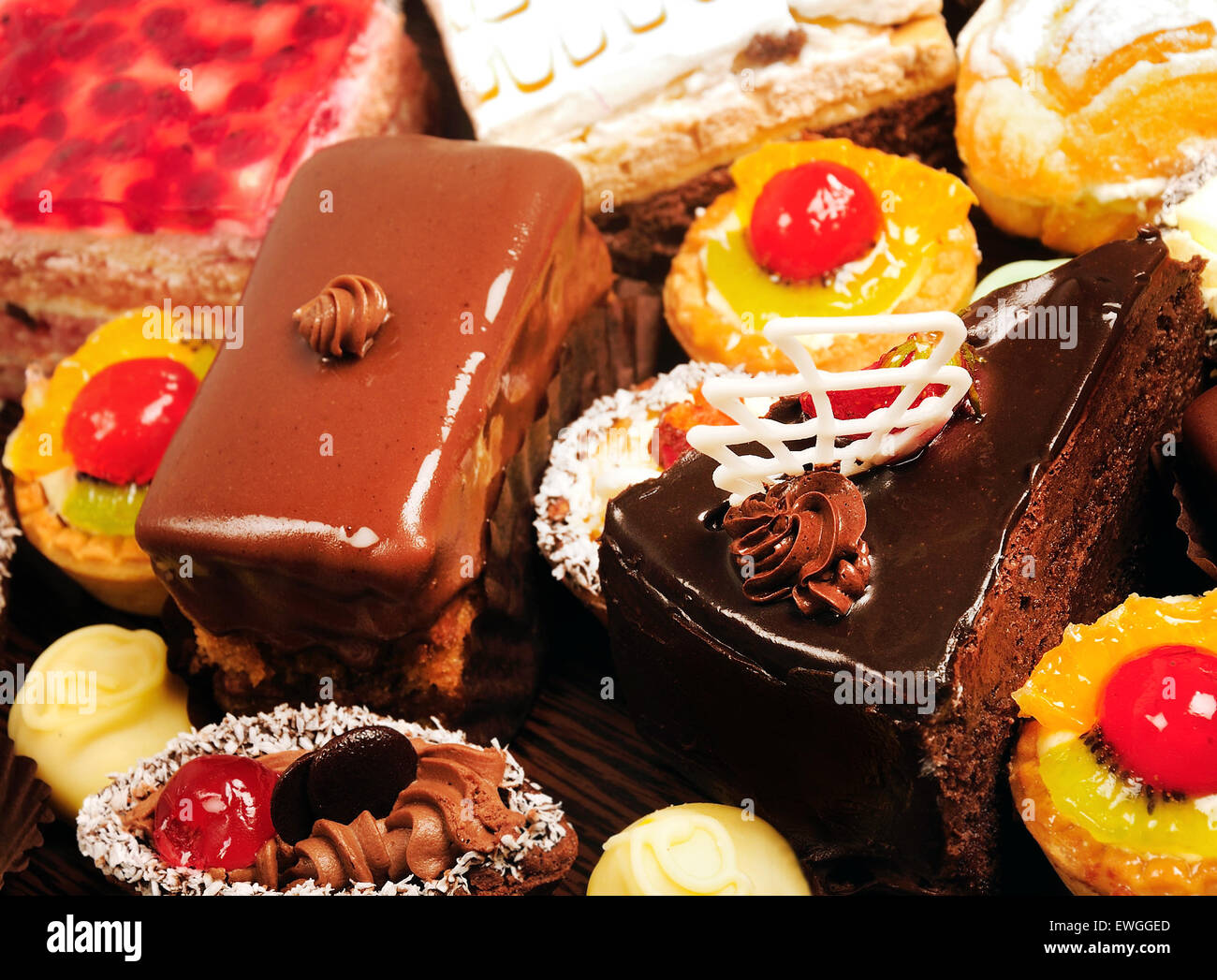 Many cakes with fruits and chocolate Stock Photo - Alamy