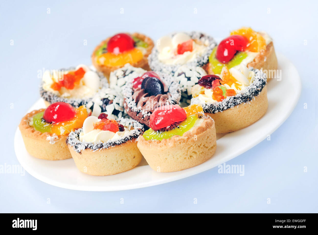 Many cakes on blue background Stock Photo - Alamy