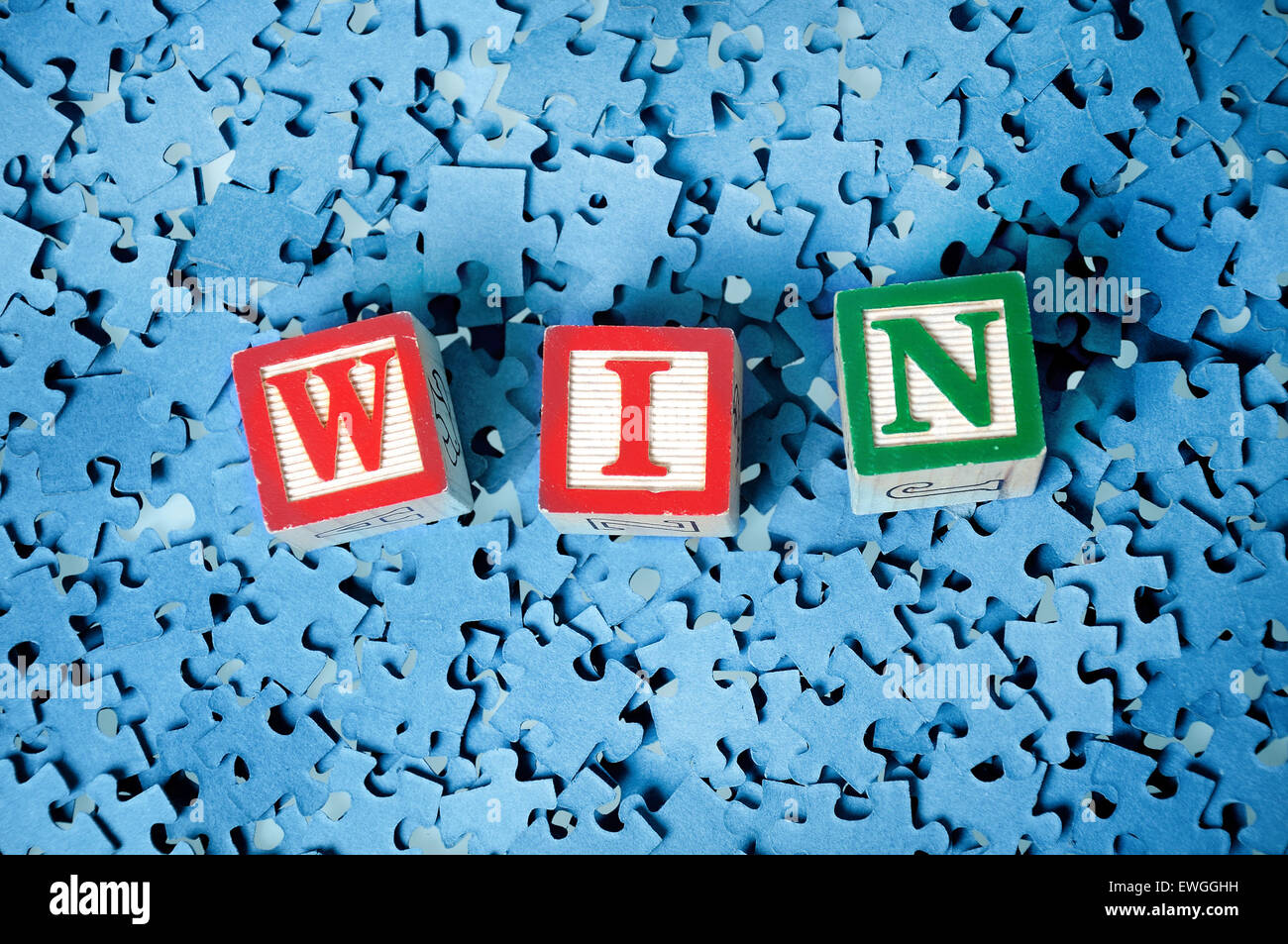 Win word on a puzzle background Stock Photo - Alamy