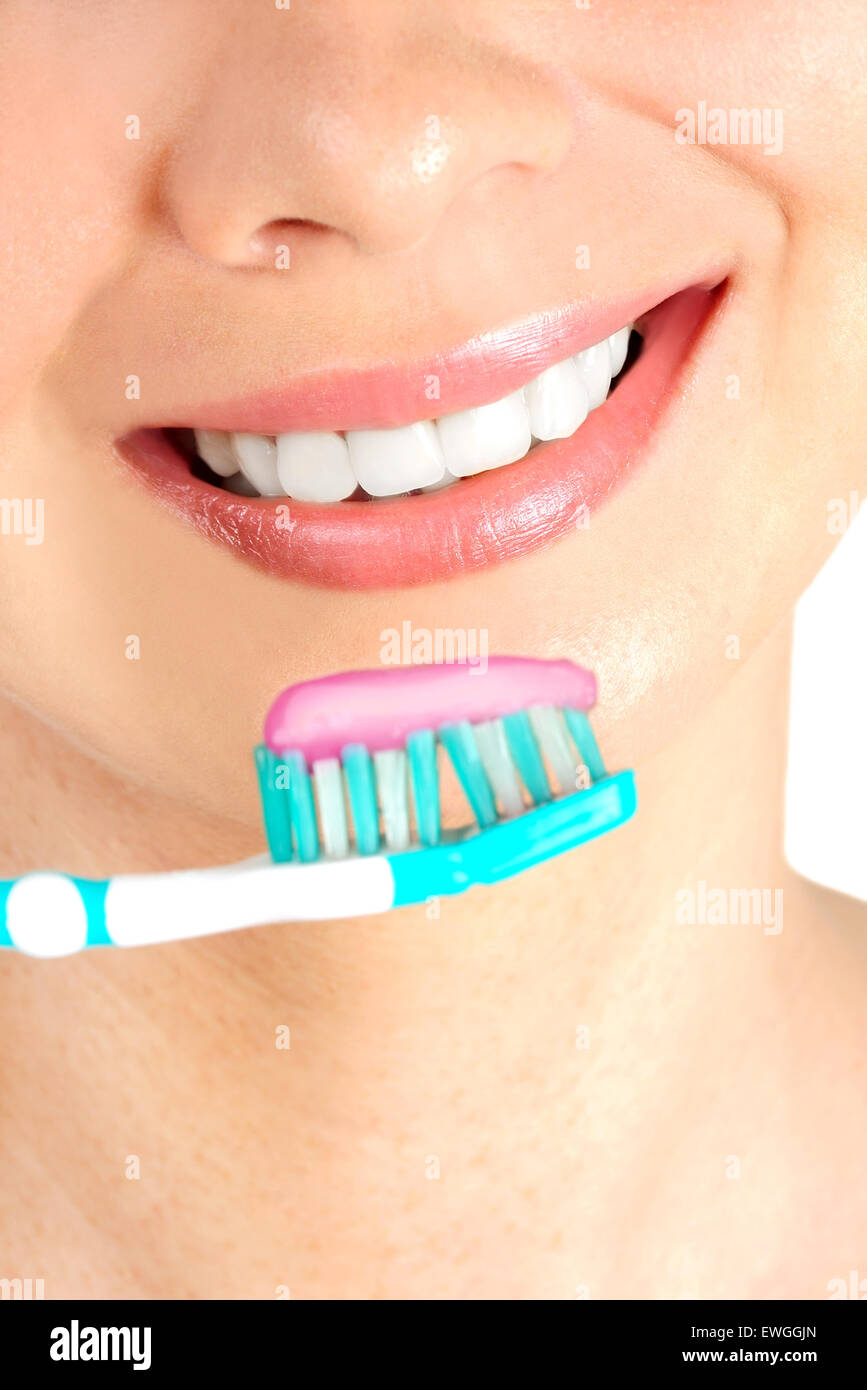 Woman cleaning teeth with toothbrush Stock Photo - Alamy