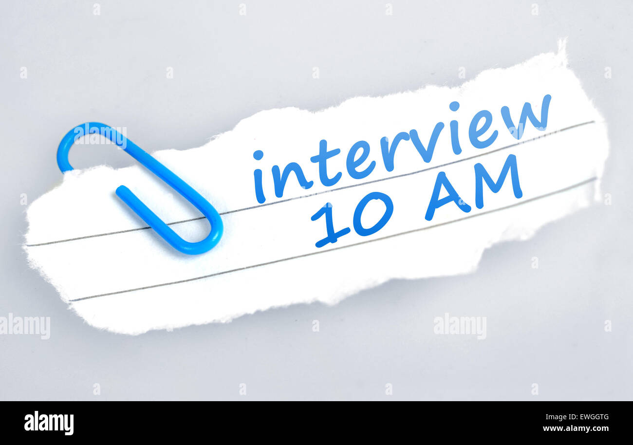 Interview 10 AM word on grey background Stock Photo - Alamy