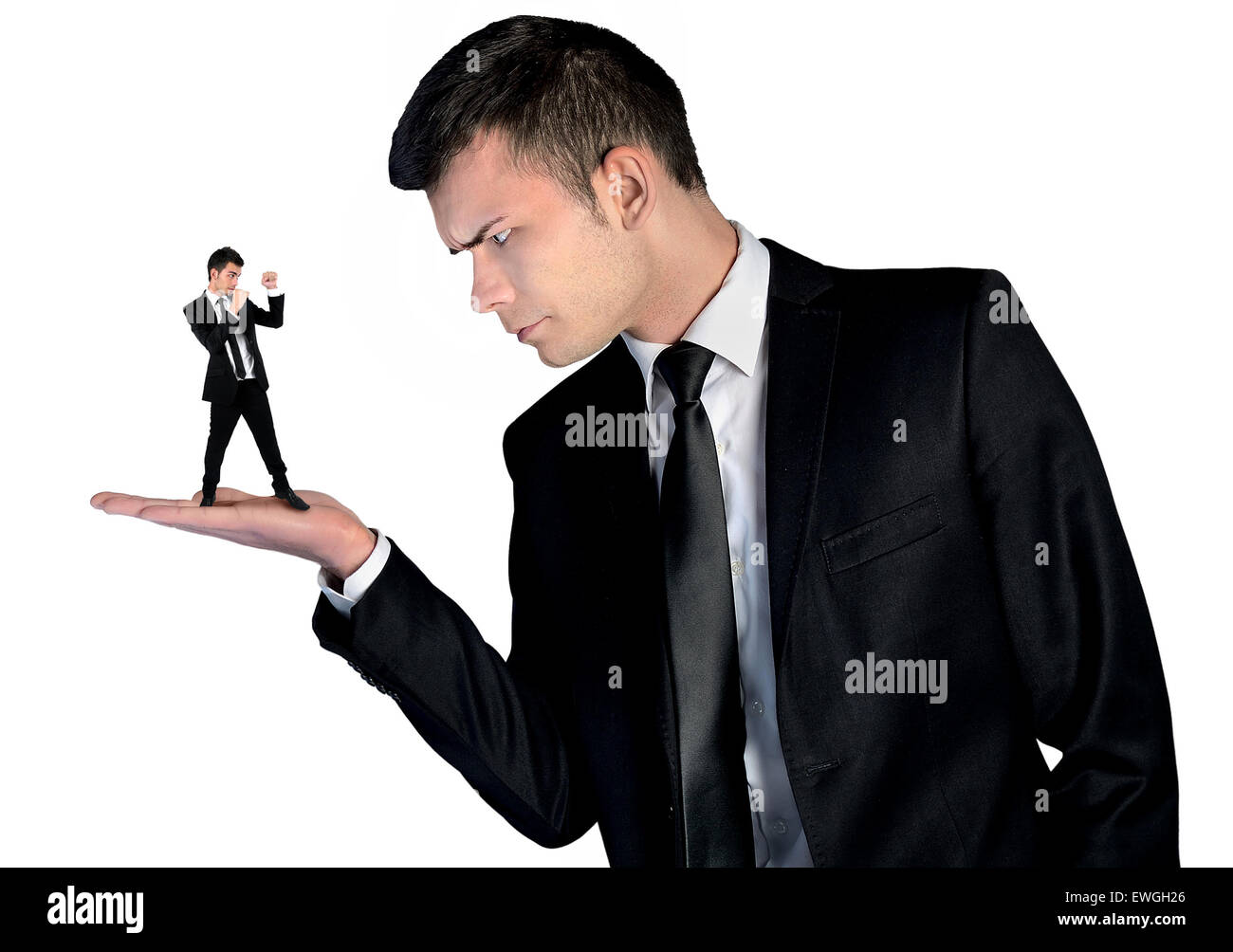 Isolated business man looking angry on little man Stock Photo - Alamy