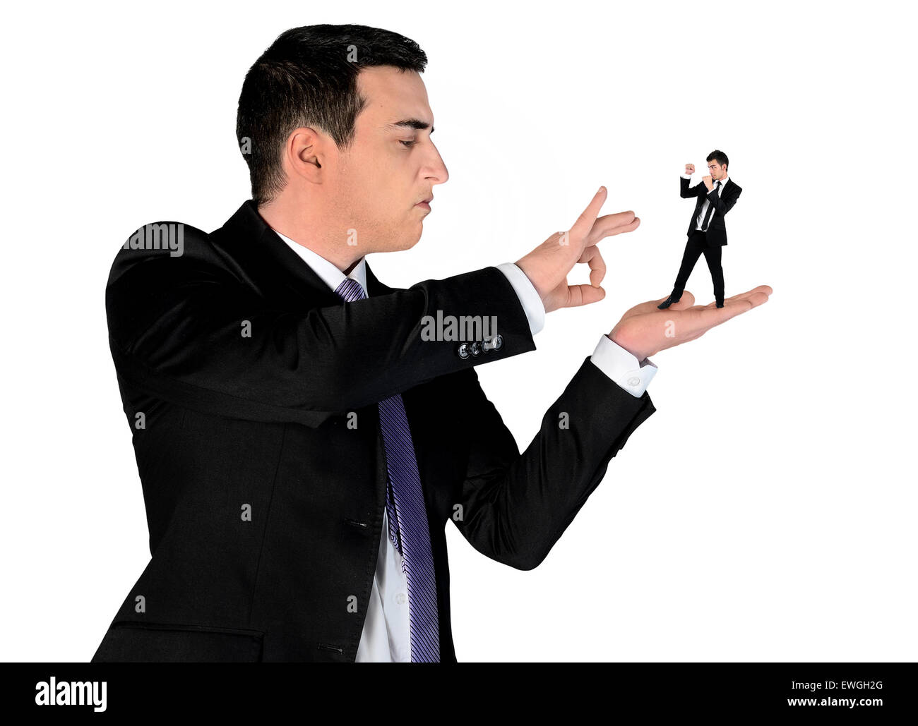 Isolated business man finger flipping on little man Stock Photo - Alamy