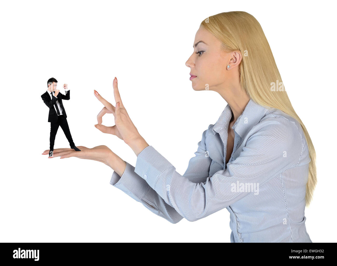 Isolated business woman finger flipping on little man Stock Photo - Alamy