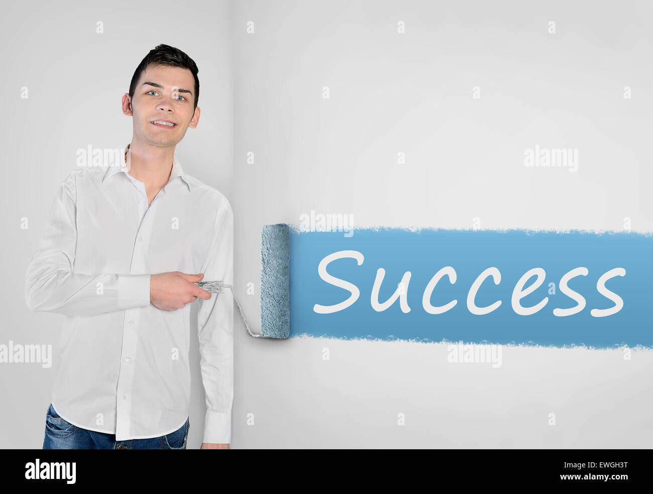 Young man painting Success word on wall Stock Photo - Alamy