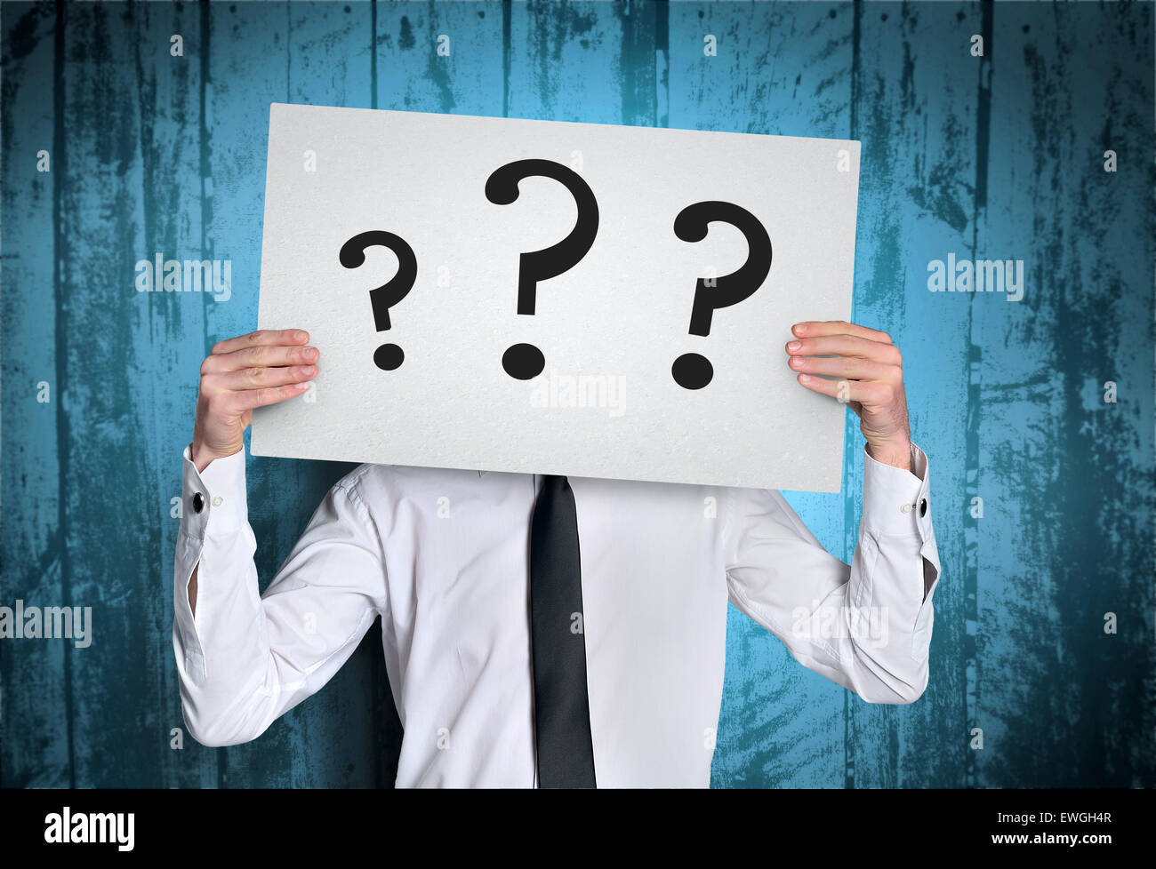 Business man cover face with question board Stock Photo - Alamy