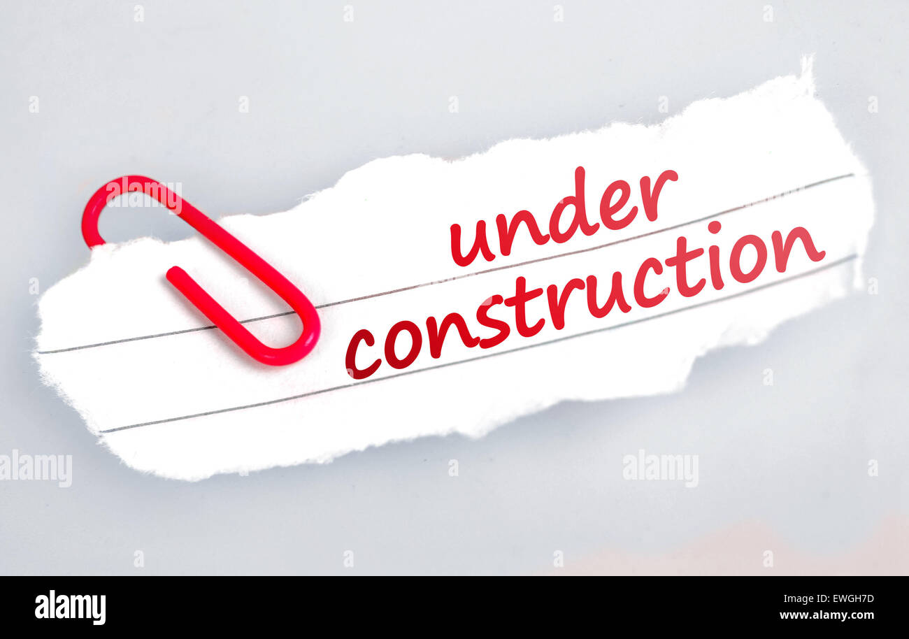 Under construction word on grey background Stock Photo - Alamy