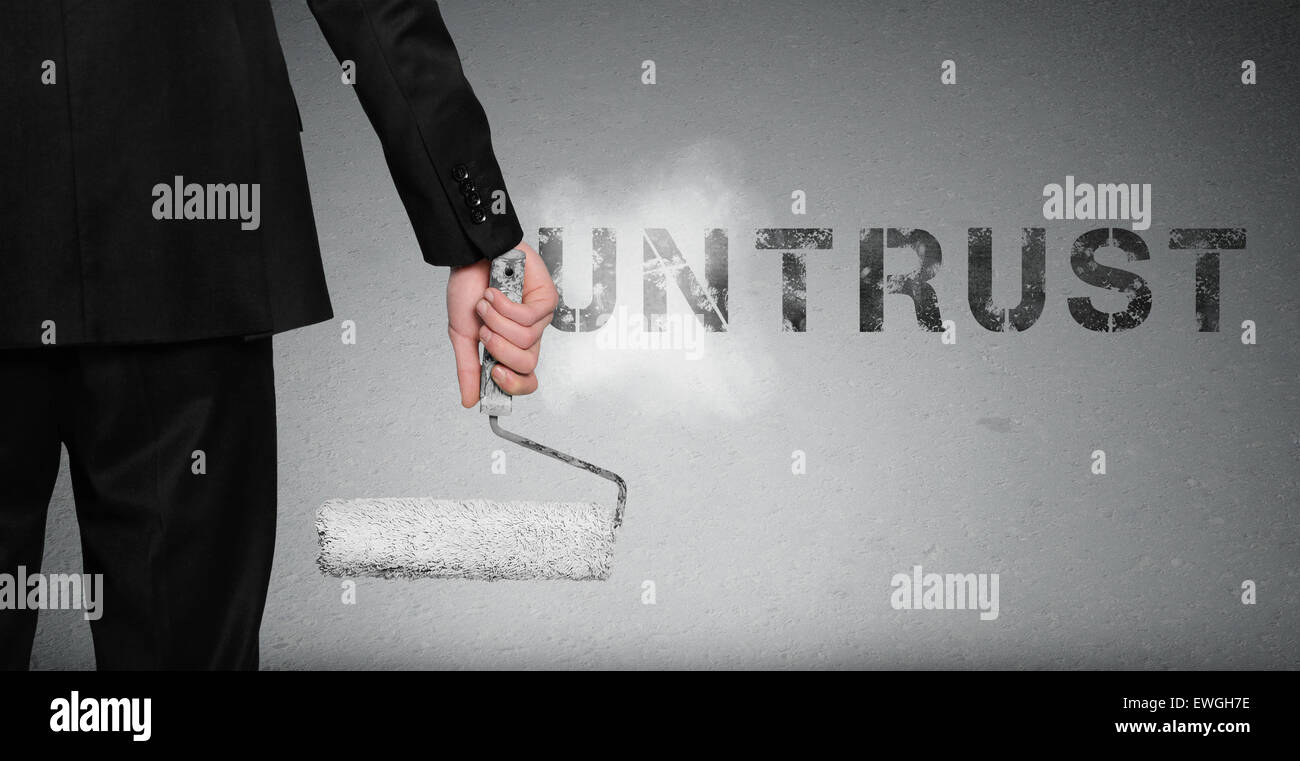 Untrust word painting on gray wall Stock Photo - Alamy