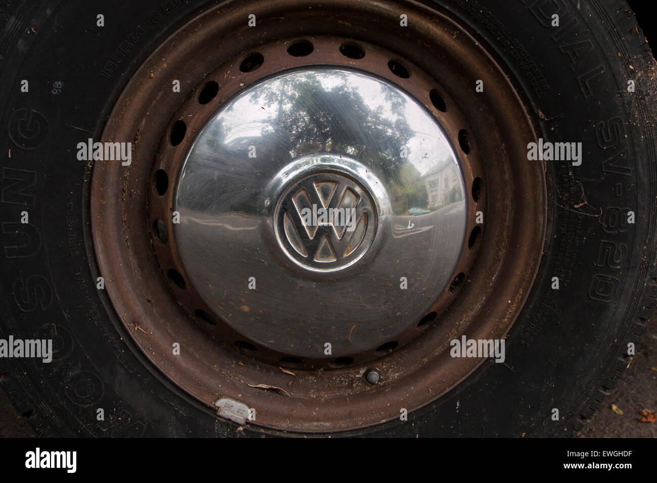 The original hubcap on a 1971 VW bus Stock Photo - Alamy