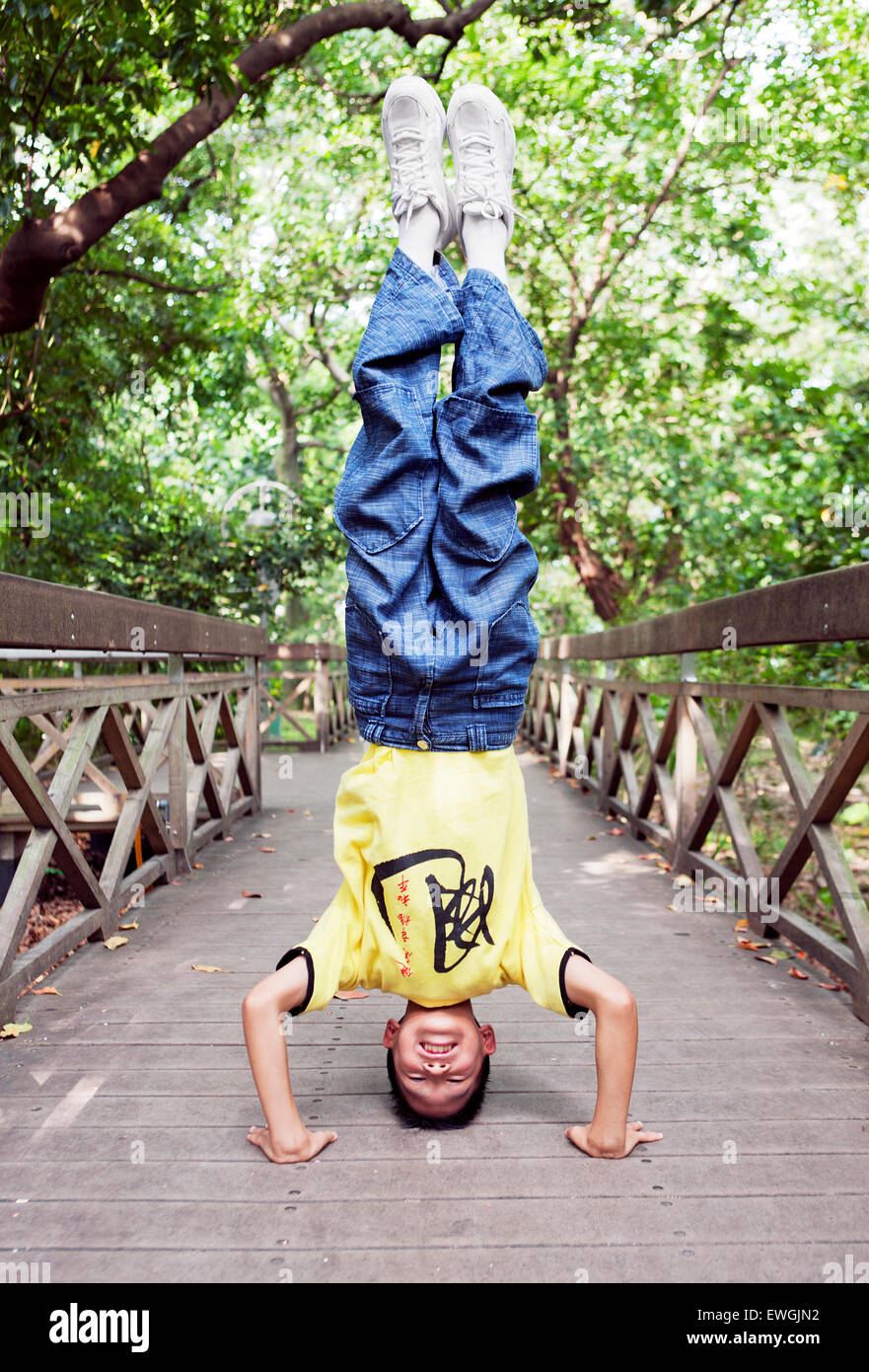 Boy doing hand stand hi-res stock photography and images - Alamy