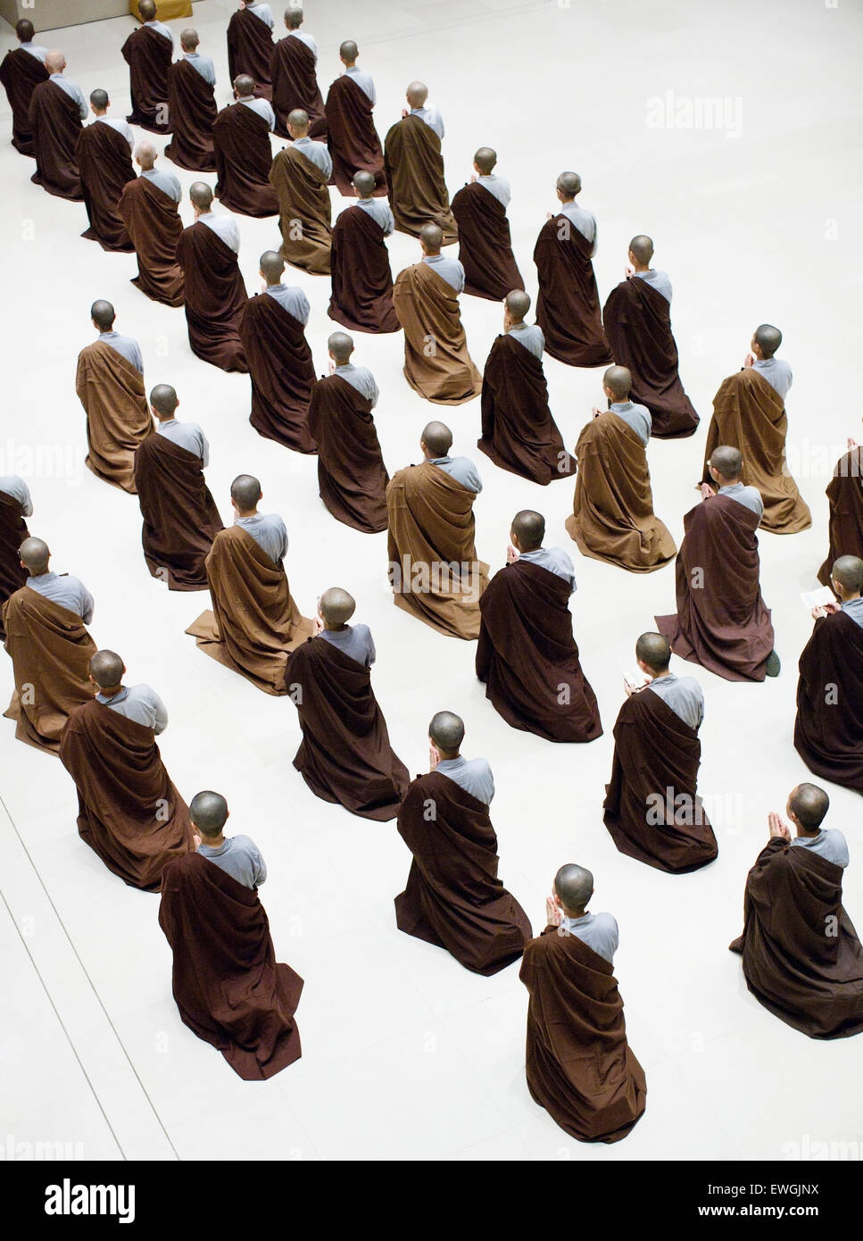Buddhist monks pray and meditate at the Dharma Drum Mountain monastry ...