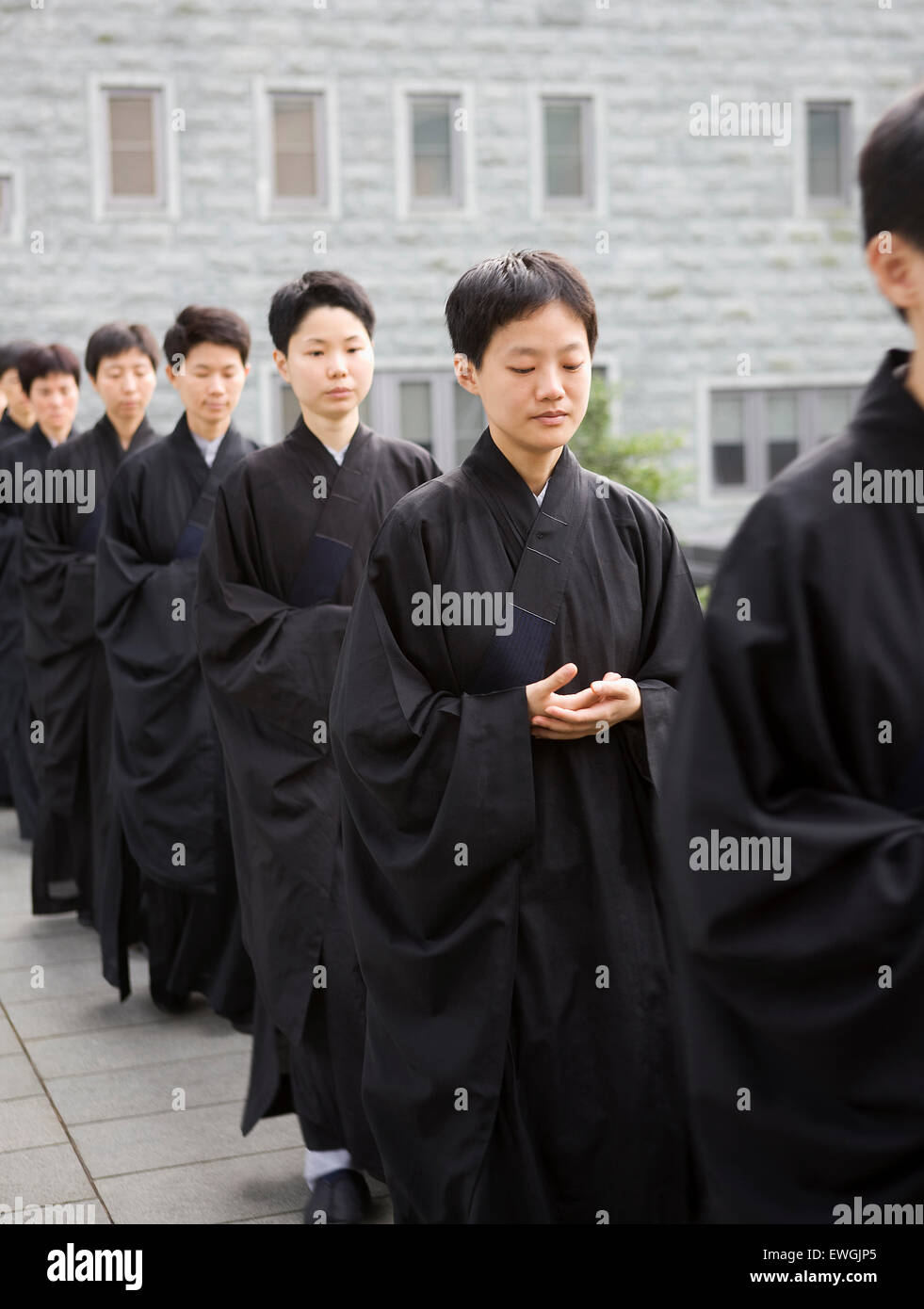 Buddhist monks pray and meditate at the Dharma Drum Mountain monastry ...