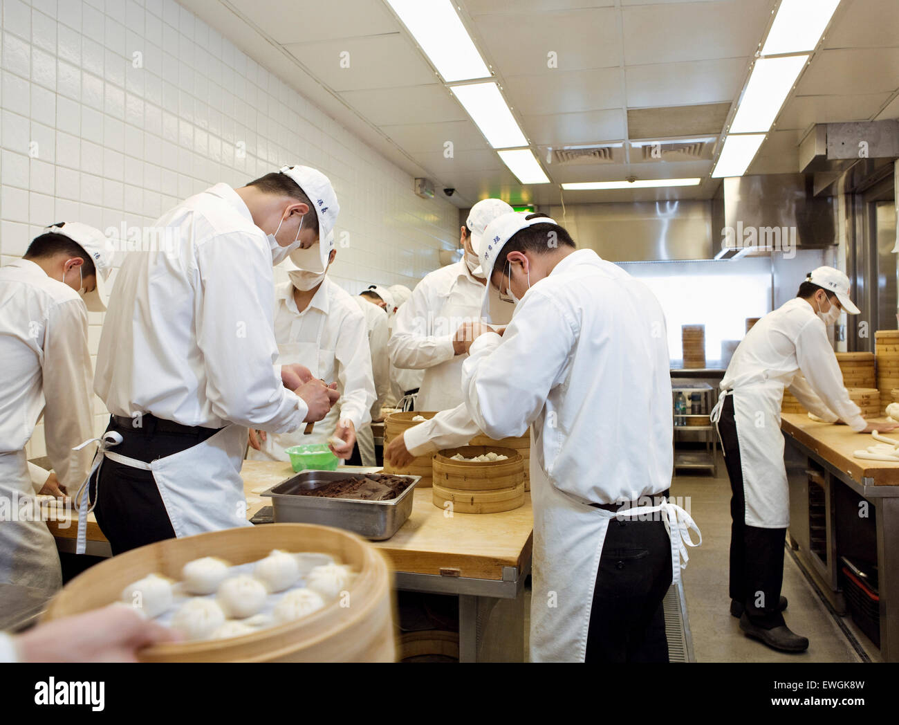 Workers prepare dumplings at Taipei's famous Din Tai Fung Dim Sum ...