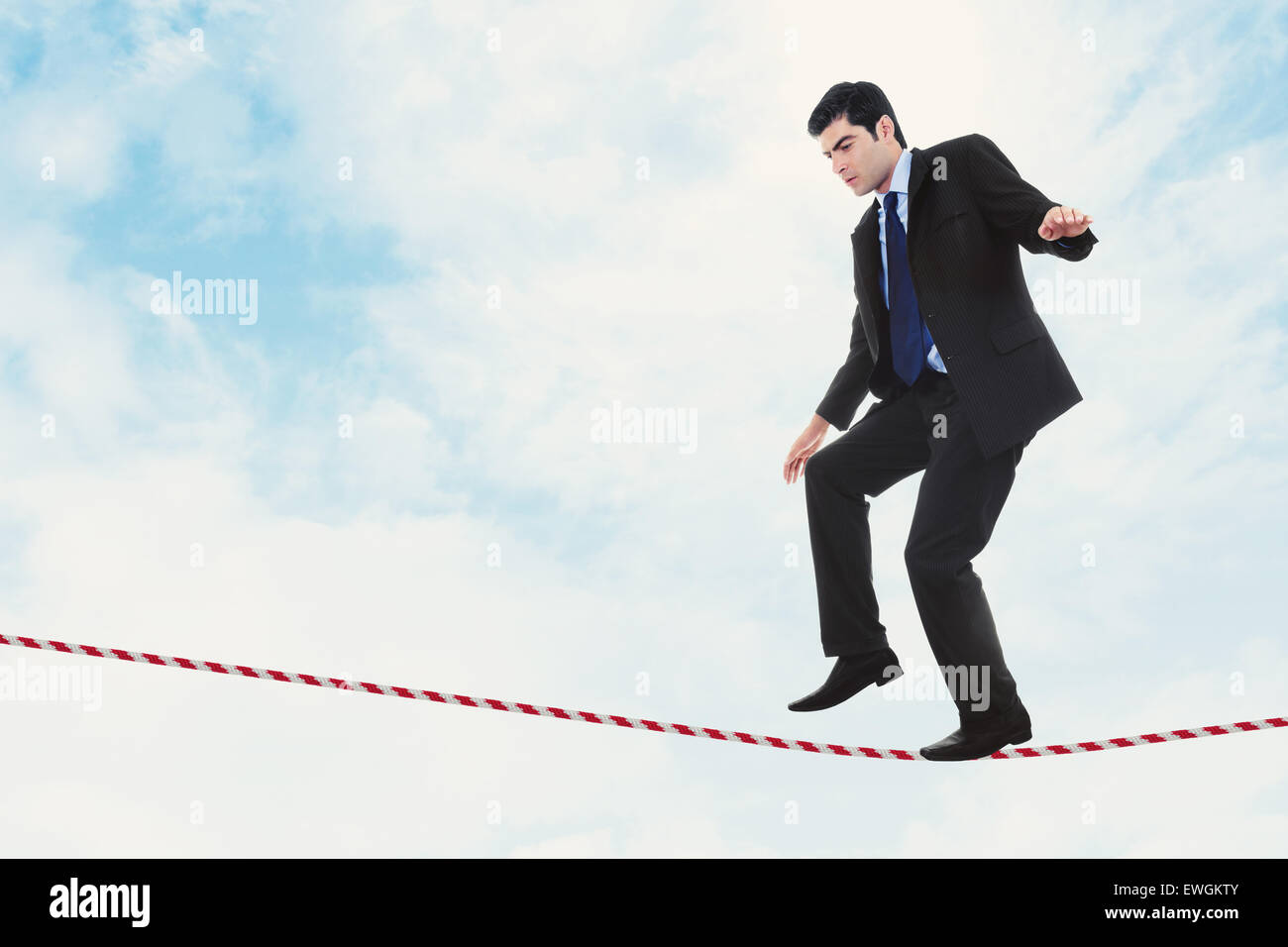 Stock image of businessman walking the tightrope Stock Photo - Alamy