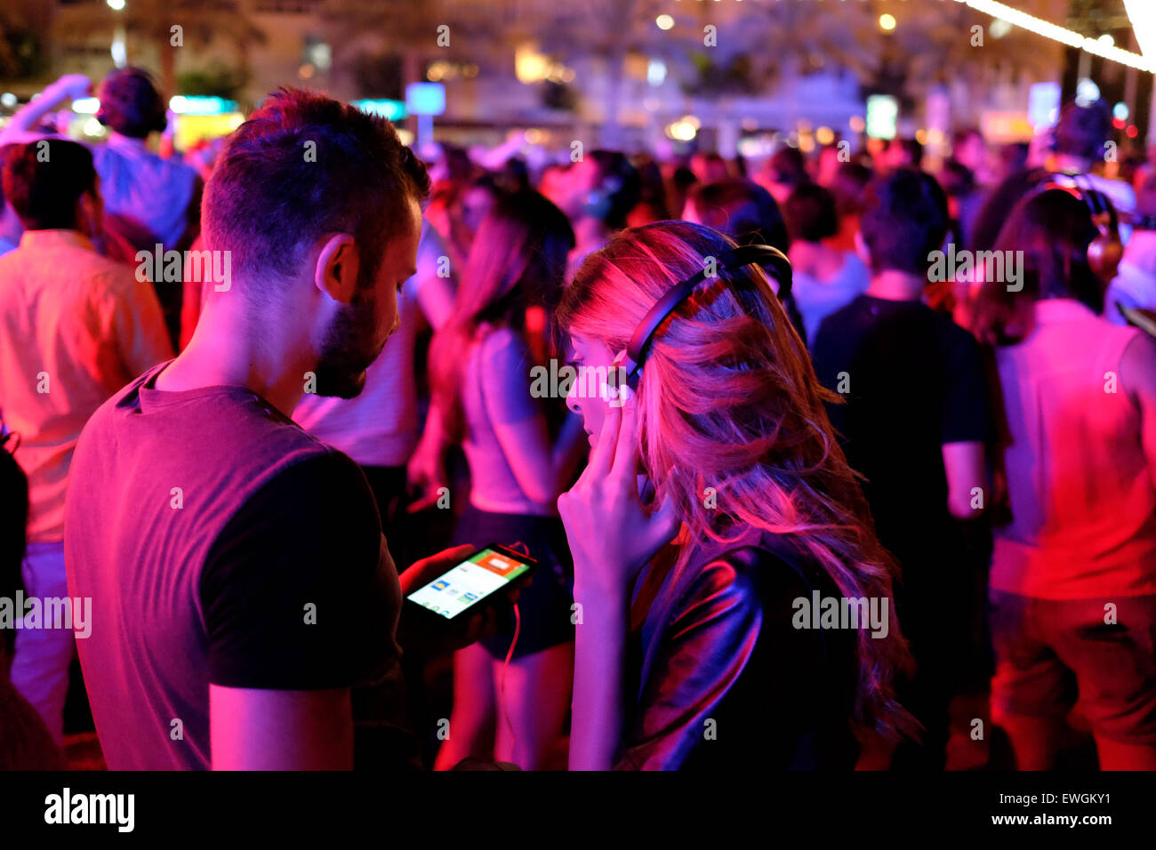 Young Israelis taking part in a huge Silent Disco Wi-Fi Headphone Party ...