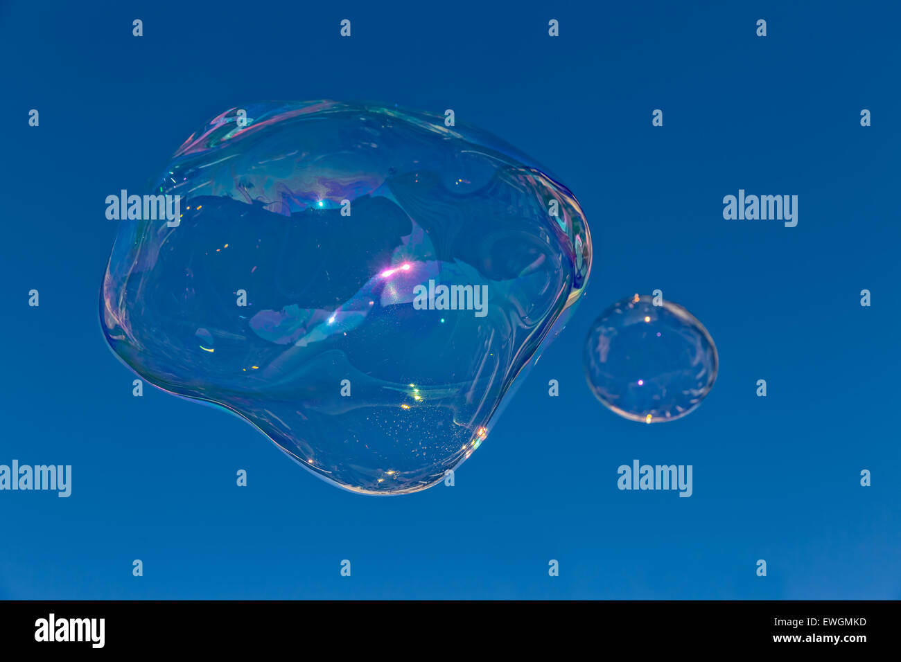 Blowing bubbles blue sky hi-res stock photography and images - Alamy