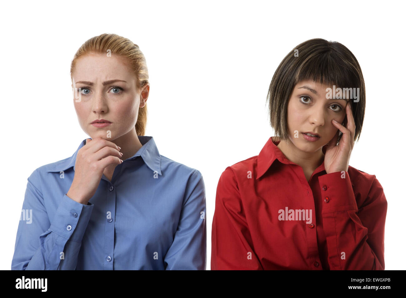 two business woman with different face expressions sanding side by side ...