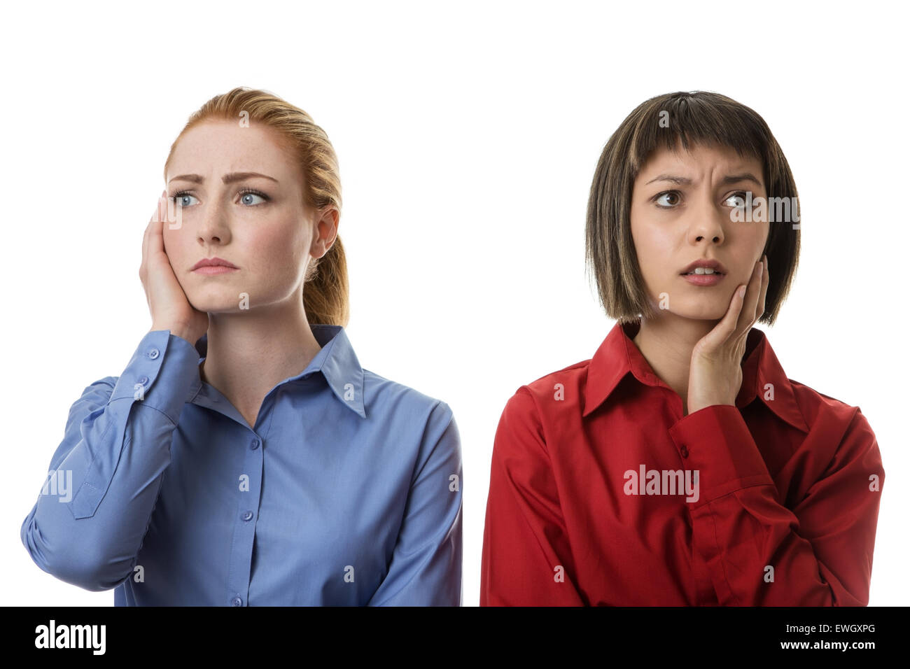 two business woman with different face expressions sanding side by side ...