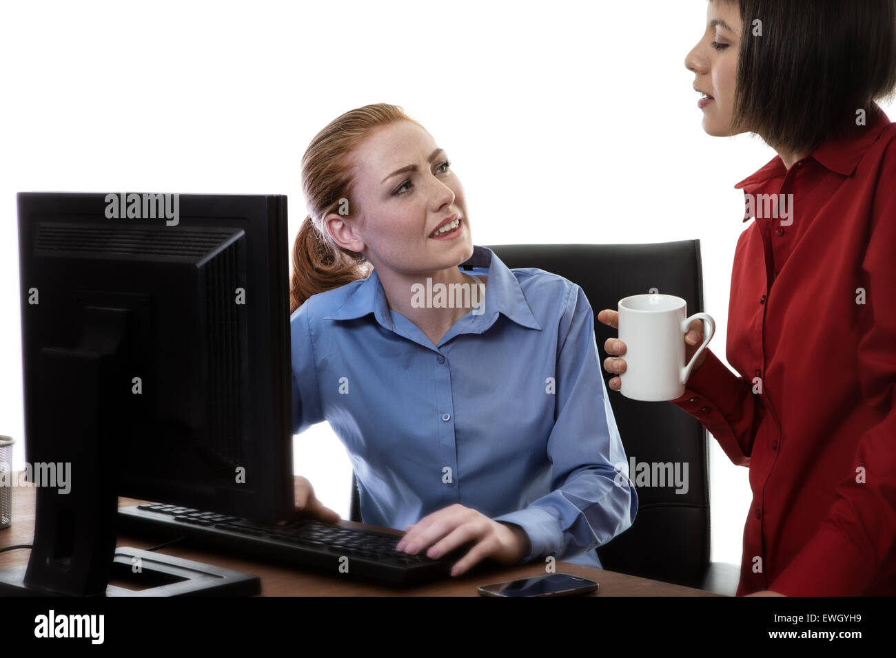 two work colleagues working together in the office Stock Photo - Alamy