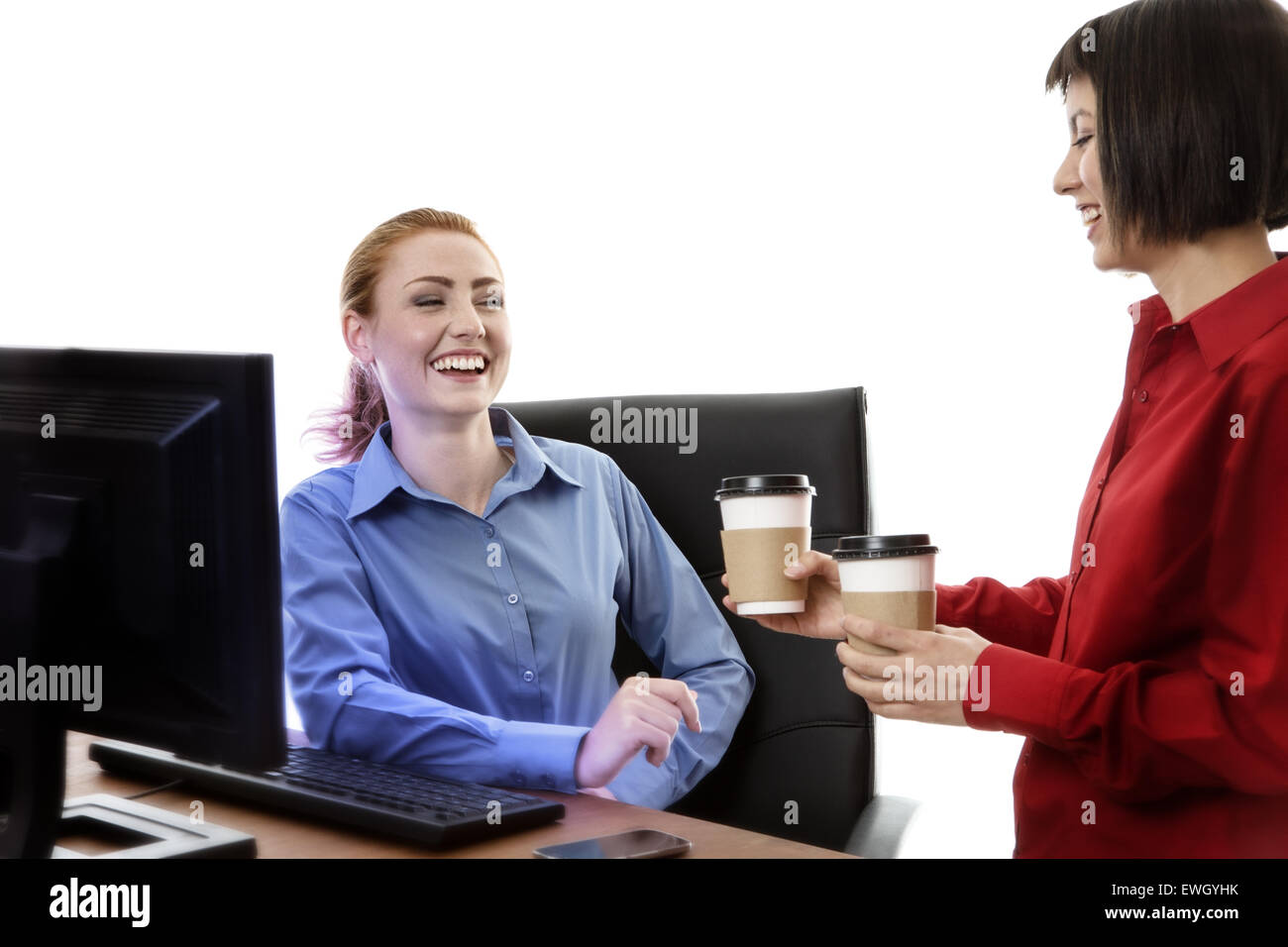 two work colleagues Having a chat and gossip at work over a coffee ...