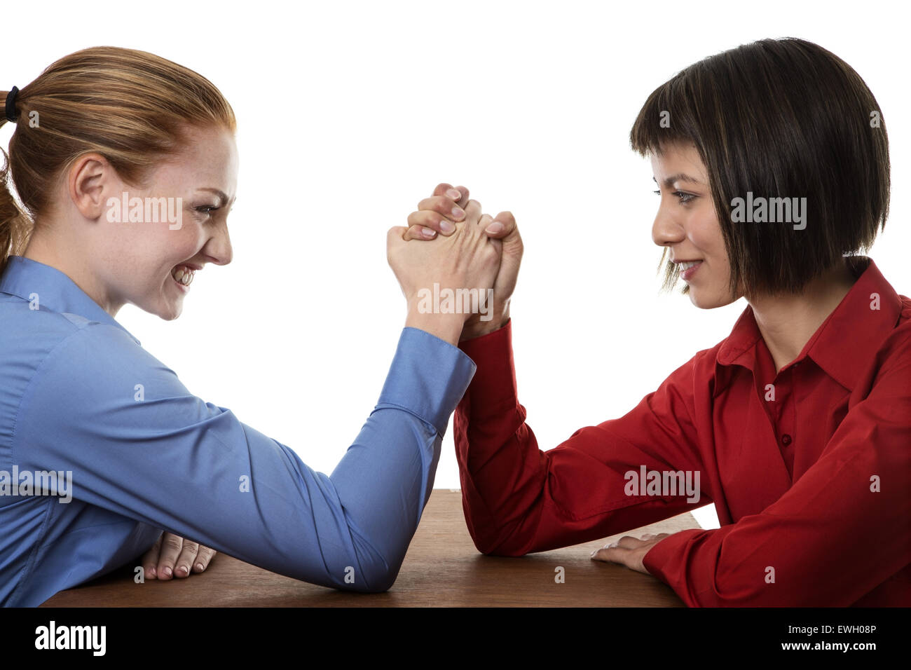 Two business women arm wrestling each other Stock Photo - Alamy