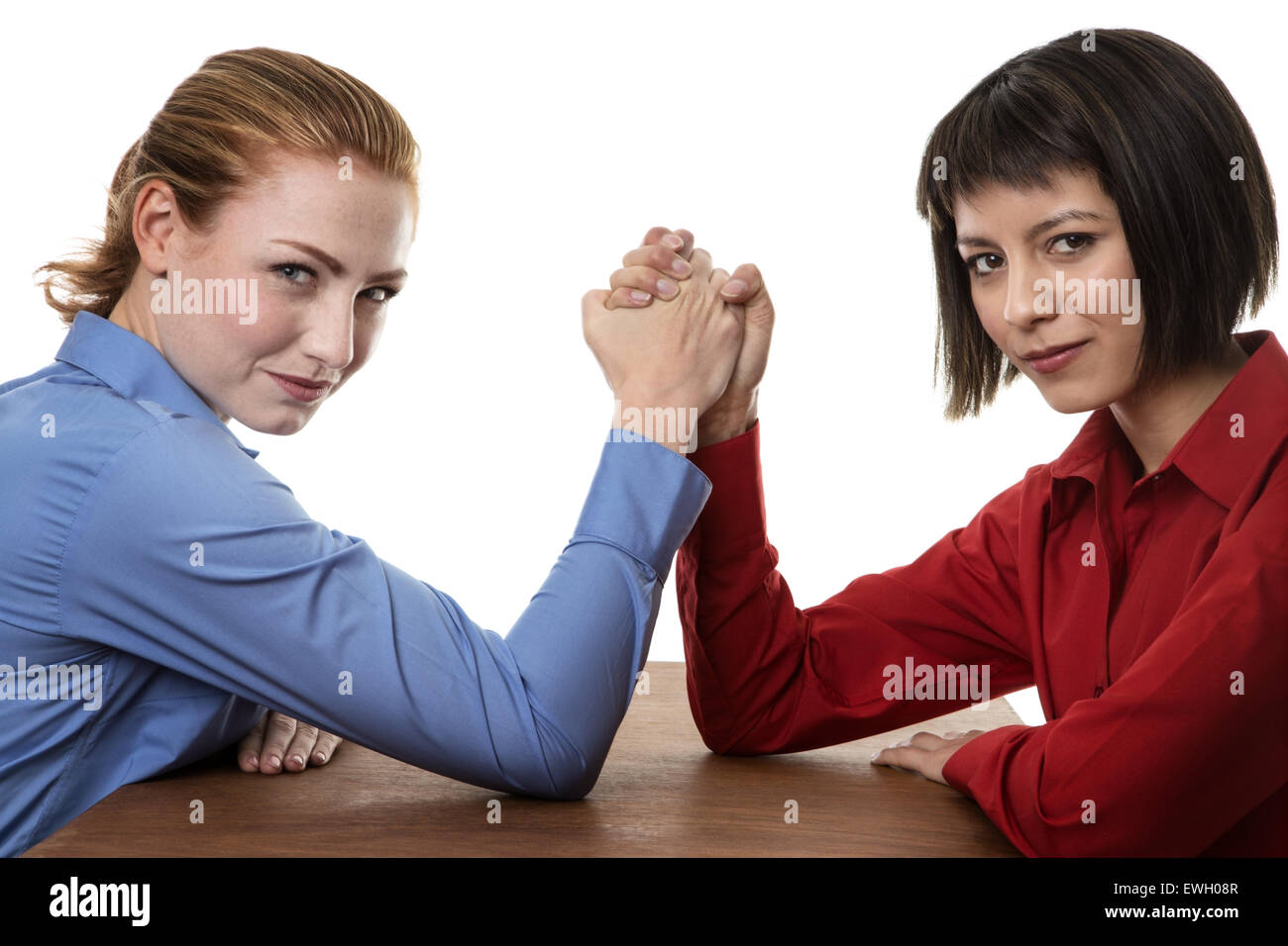 Two business women arm wrestling each other Stock Photo - Alamy