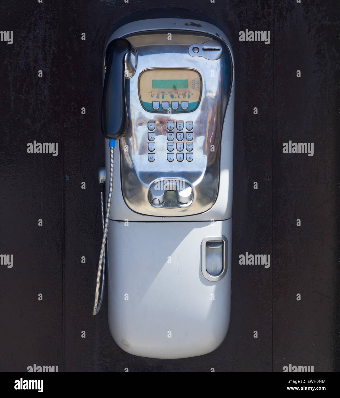 public telephone wall Stock Photo - Alamy