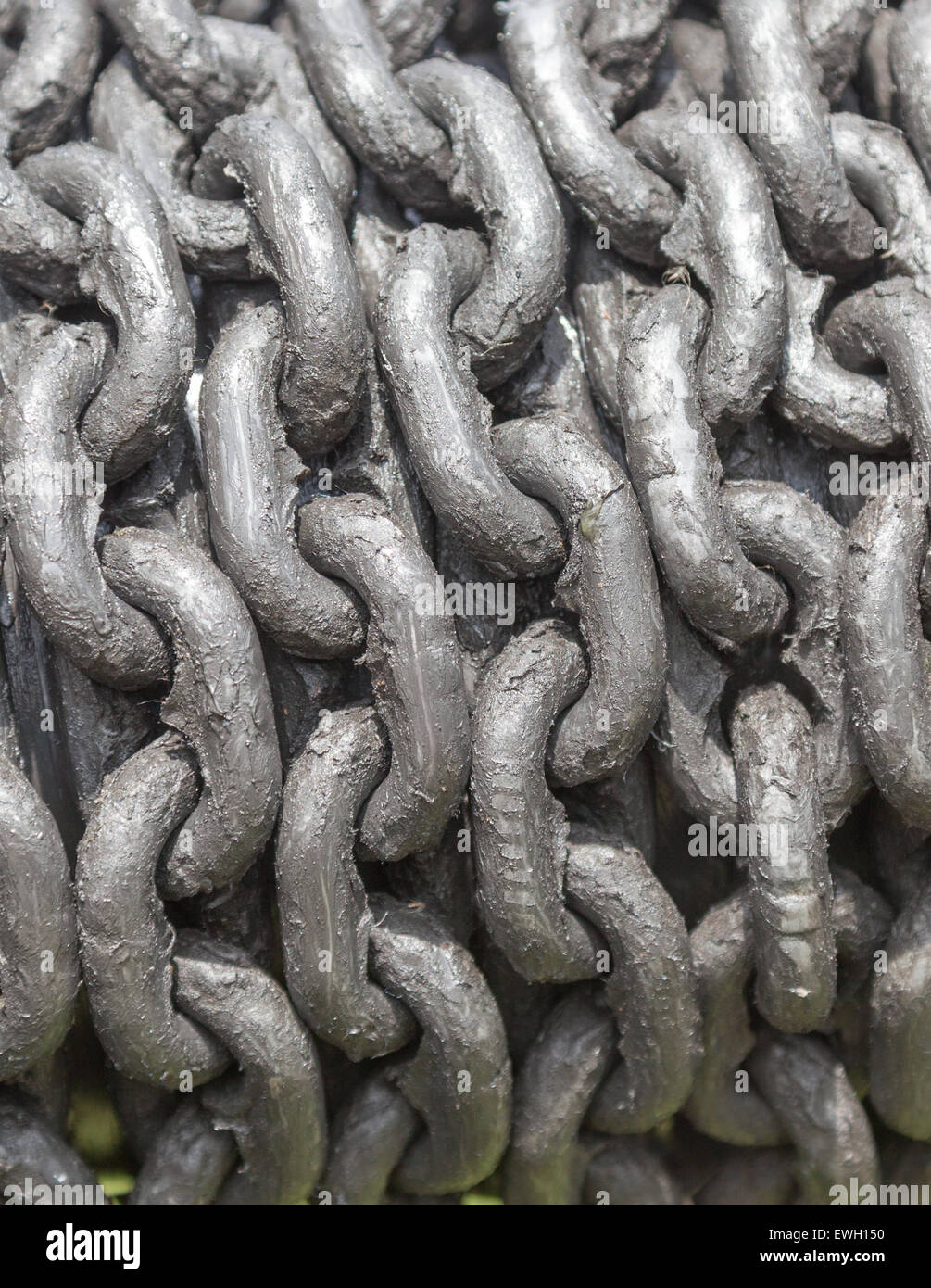 silver metal chain rolled up Stock Photo - Alamy