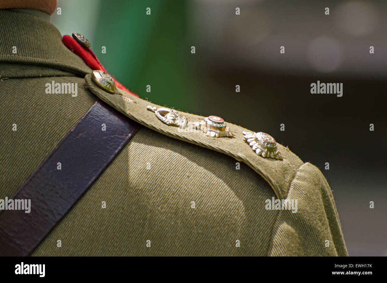 Rear view of the shoulder of a man wearing the uniform of a WW2 British ...