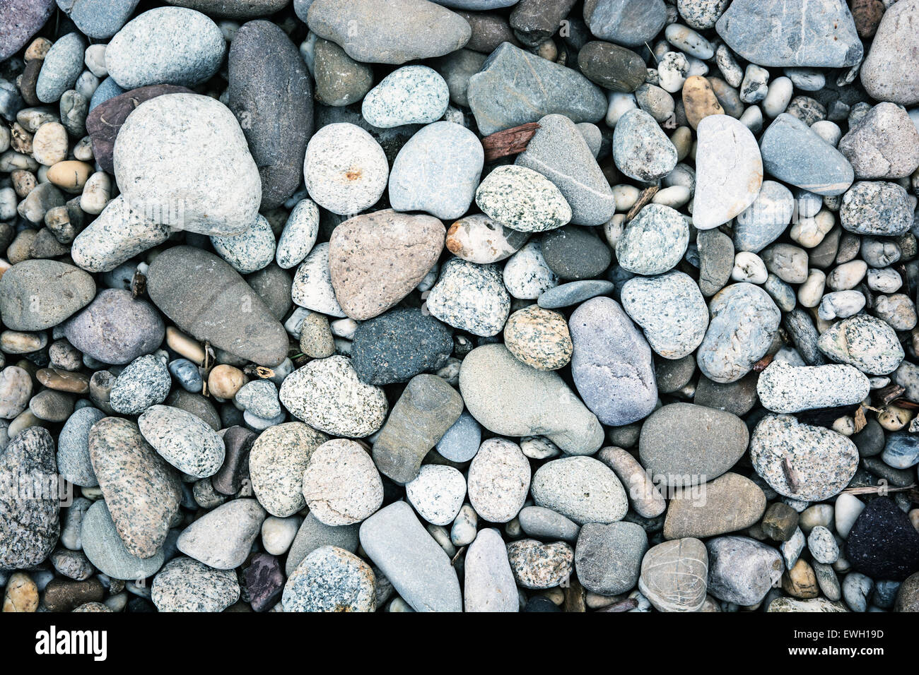 Background of smooth blue stones. Toned effect Stock Photo - Alamy