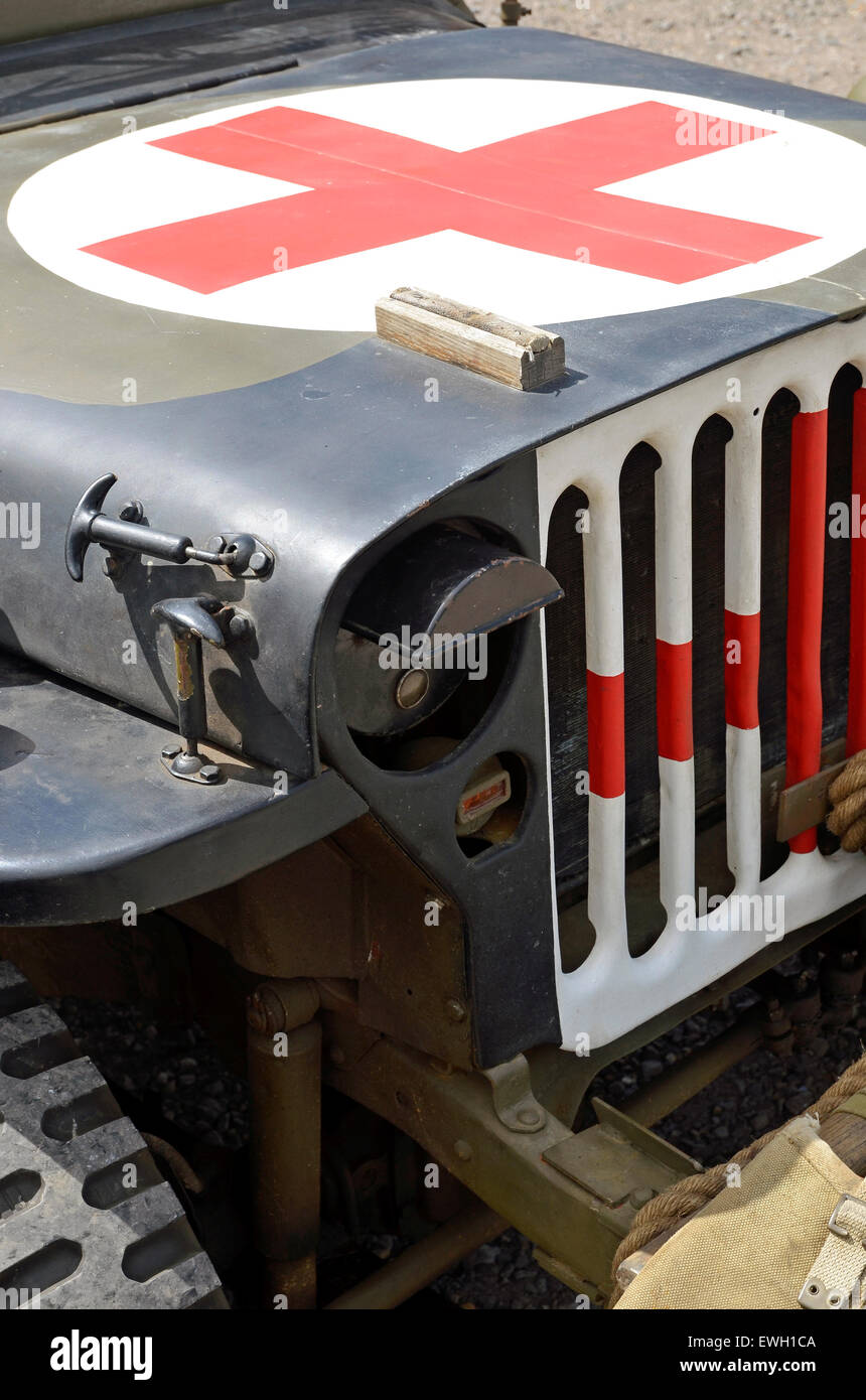 A WW2 Willys Jeep carrying painted Red Cross badges to show that it's a ...