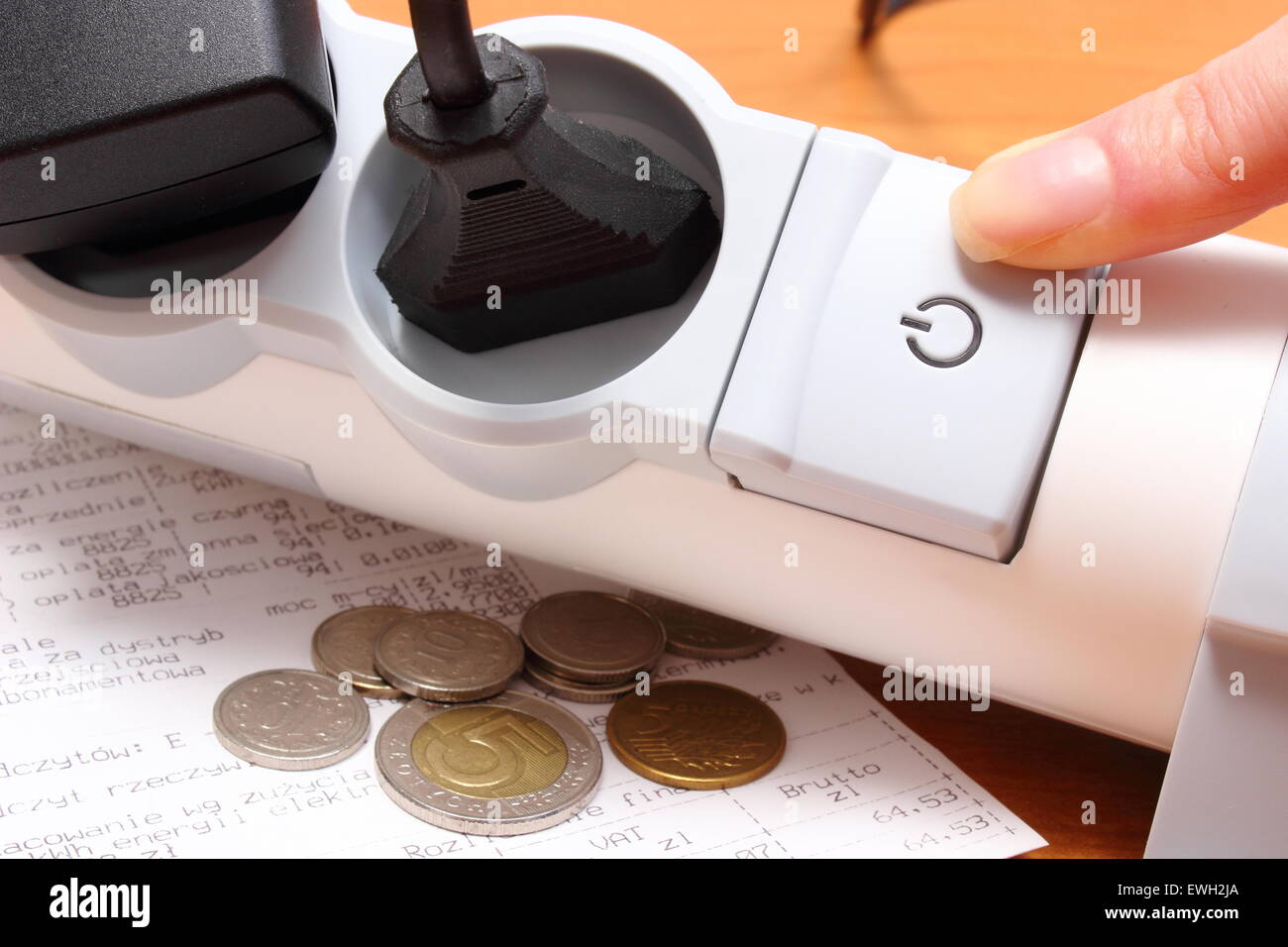 Finger of woman turns off electrical extension, electrical plugs ...