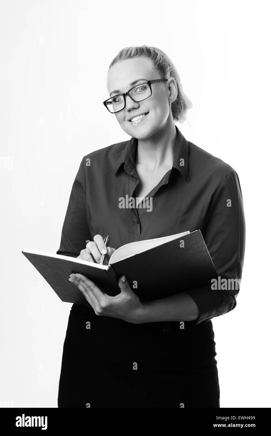 standing business woman working and checking or making note in a large ...