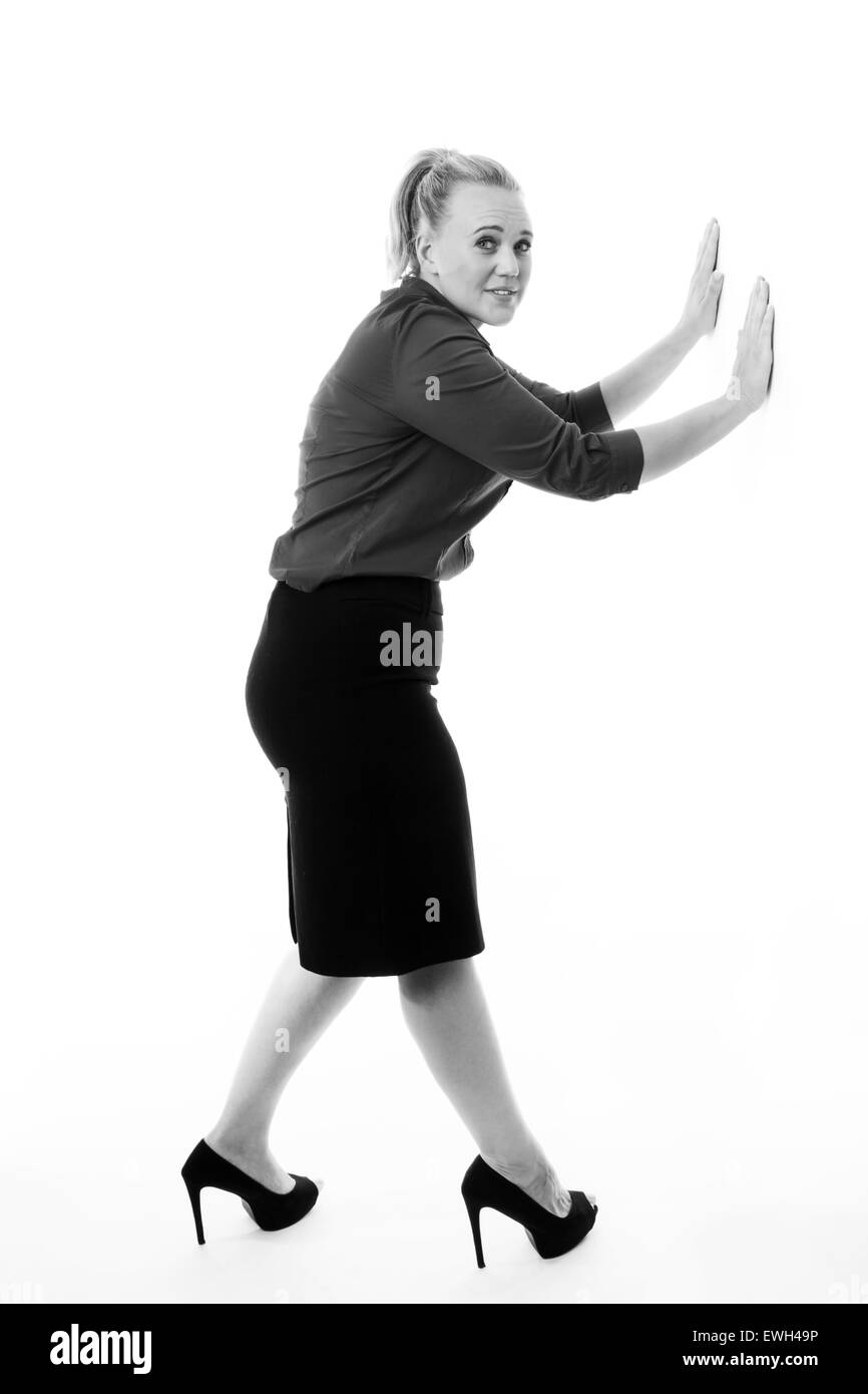 business woman pushing at something to her side Stock Photo - Alamy