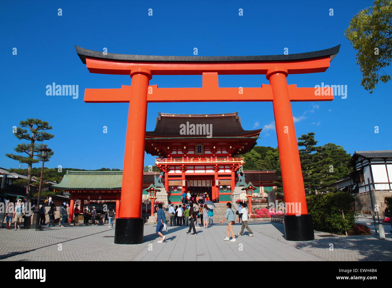 A giant torii gate in front of the Romon Gate at Fushimi Inari Shrine's ...